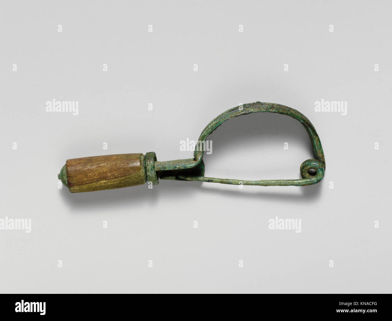 Bronze bow-shaped fibula (safety pin) with bone cylinder MET DP243851 ...