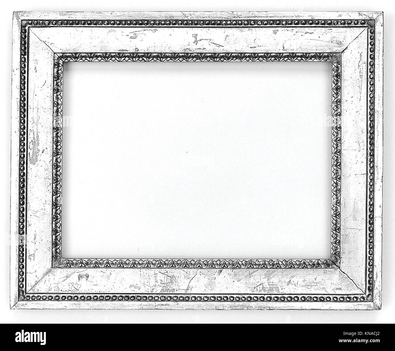 This cassetta frame, typically used for holding artwork or photographs, features intricate ...