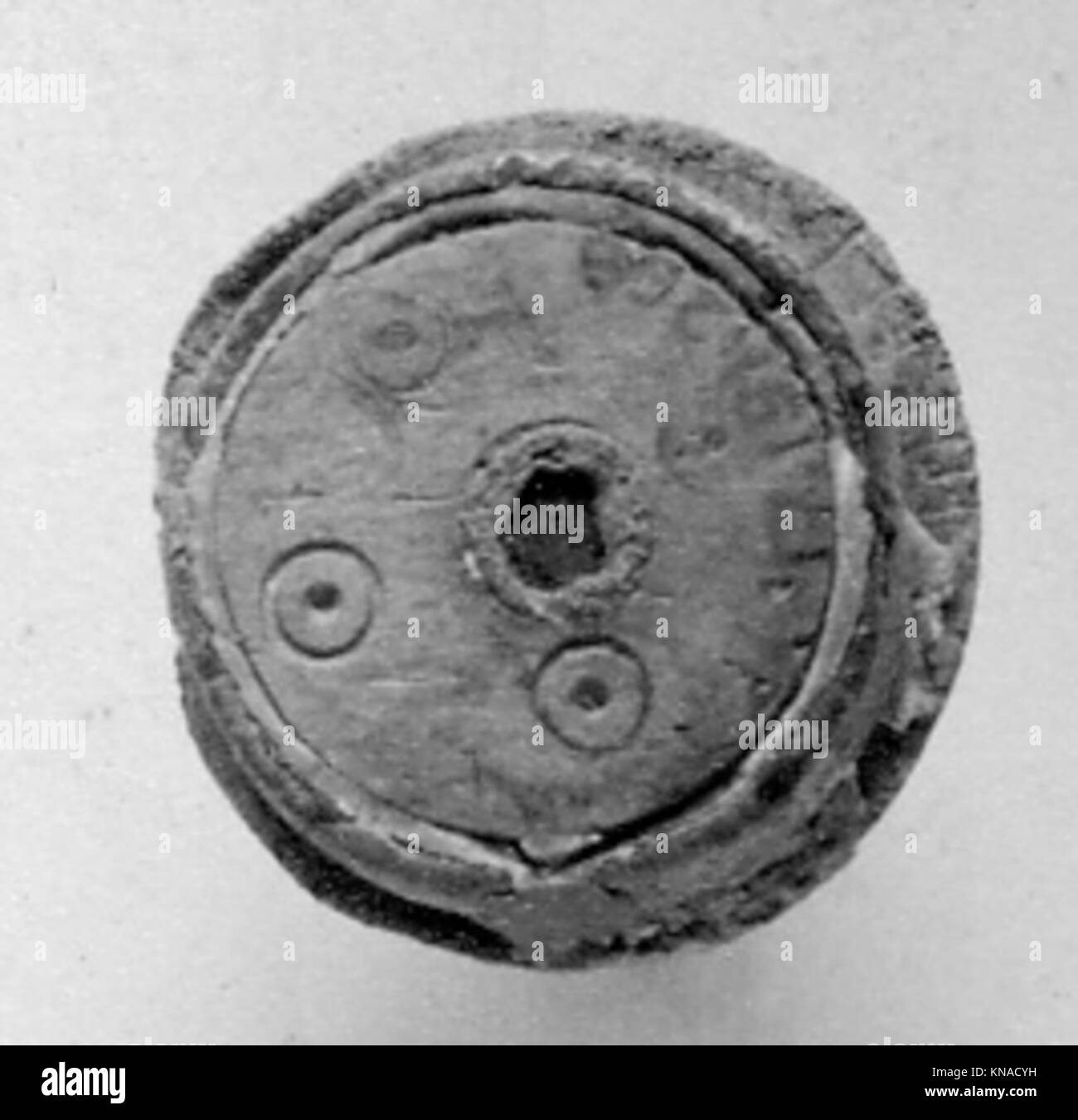 This flat circular button, dating from the 7th century, is crafted from ...