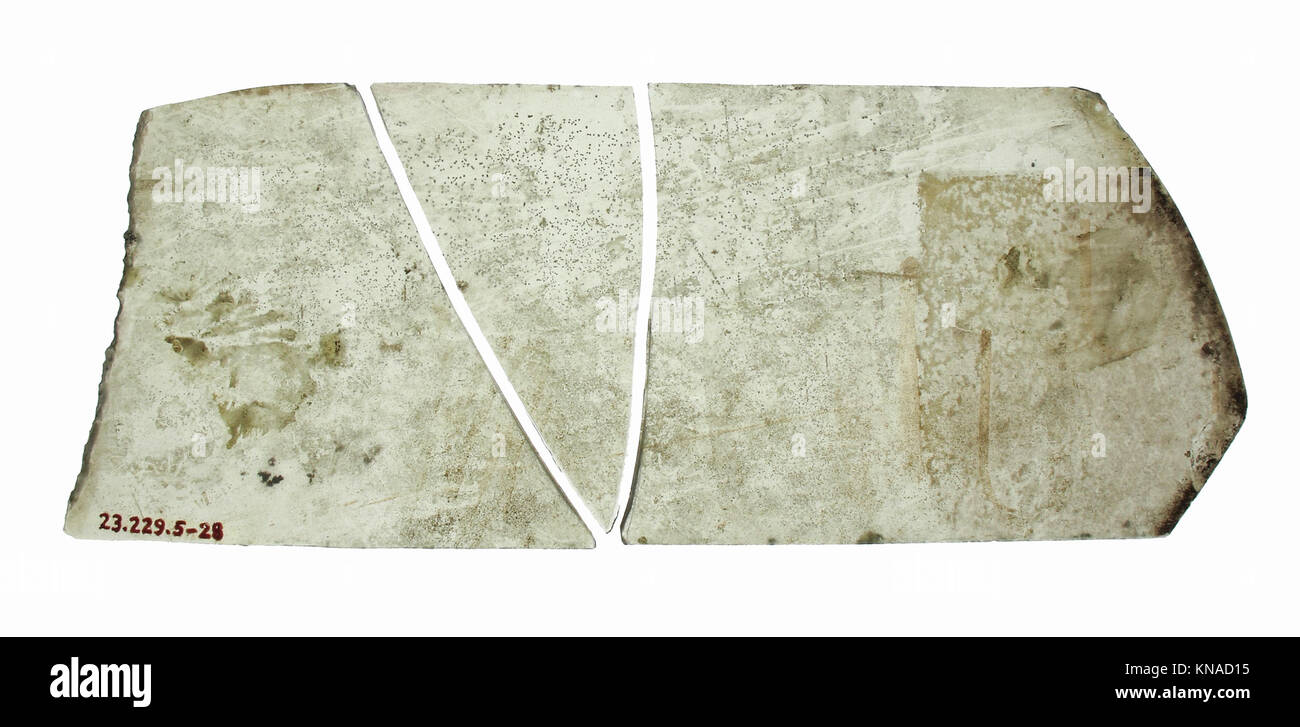 A fragment of glass, likely from a larger object. The fragment offers ...