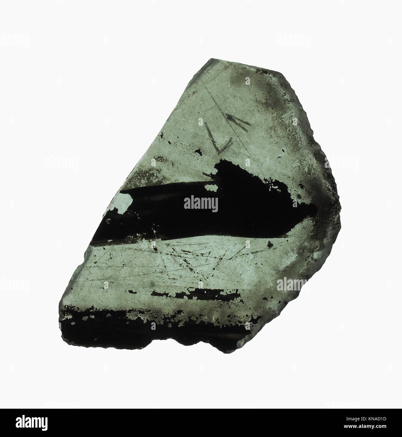 A fragment of glass, potentially from an ancient or historical object ...