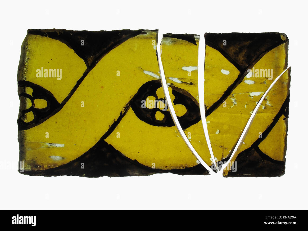 This glass fragment is part of a larger artifact, likely from an ...