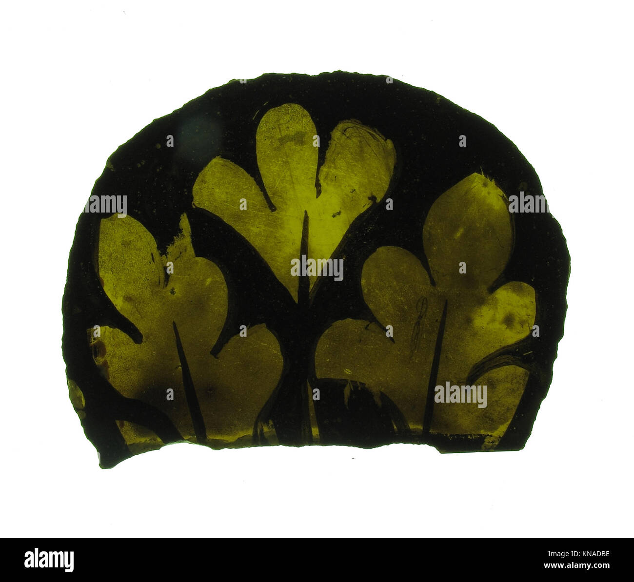 This glass fragment originates from an ancient or historical glass ...