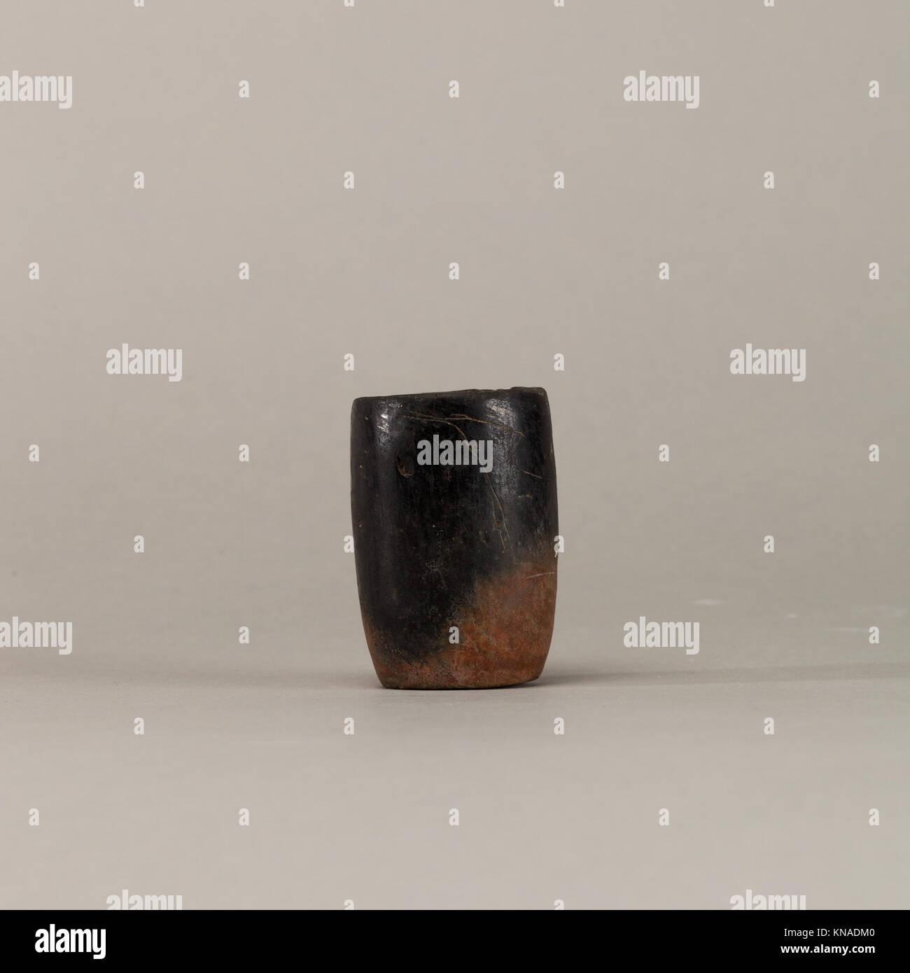 This black-topped red ware cylindrical jar is an example of ancient ...