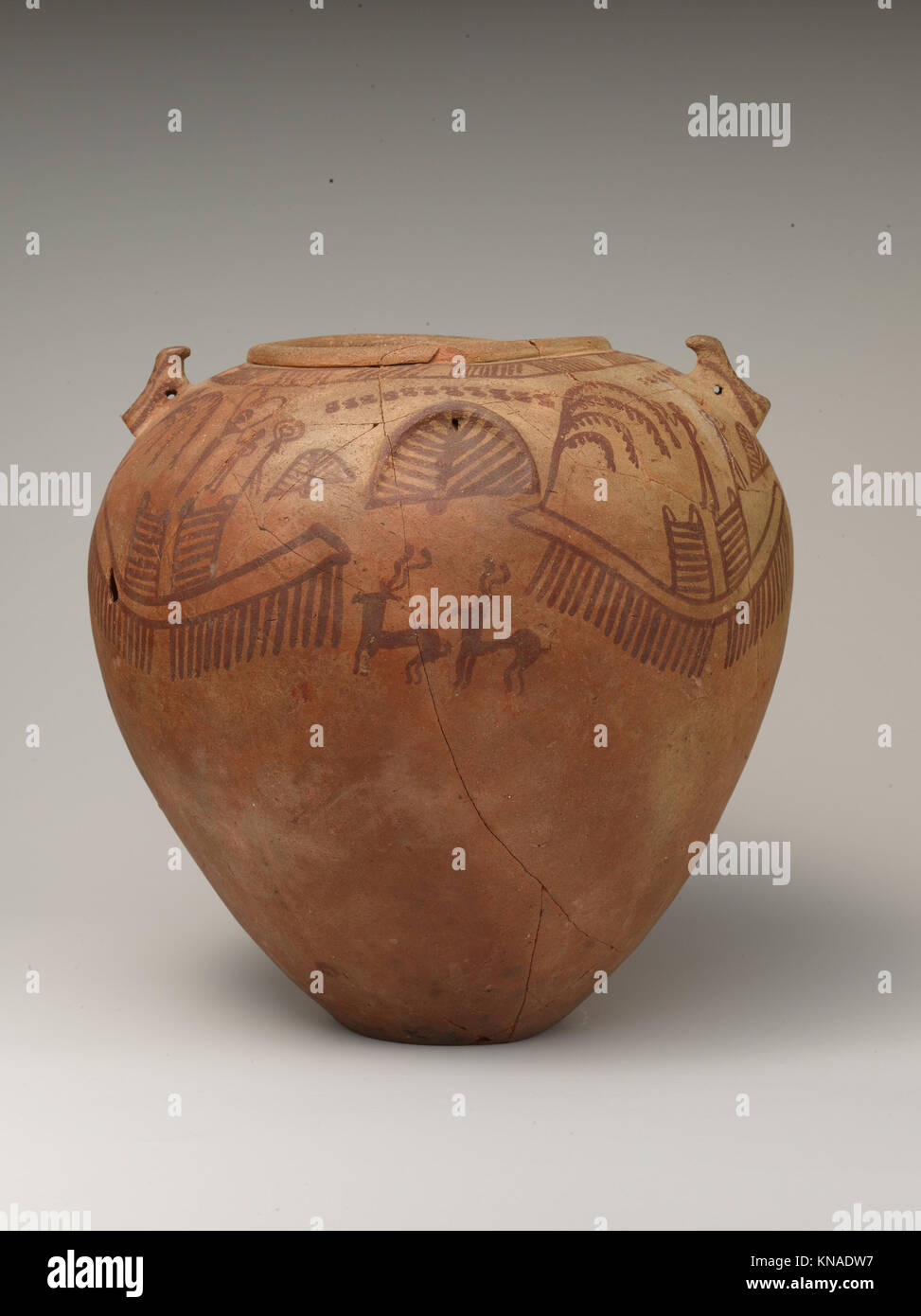 Decorated ware jar with boats and human figures and falcon-styled lugs ...
