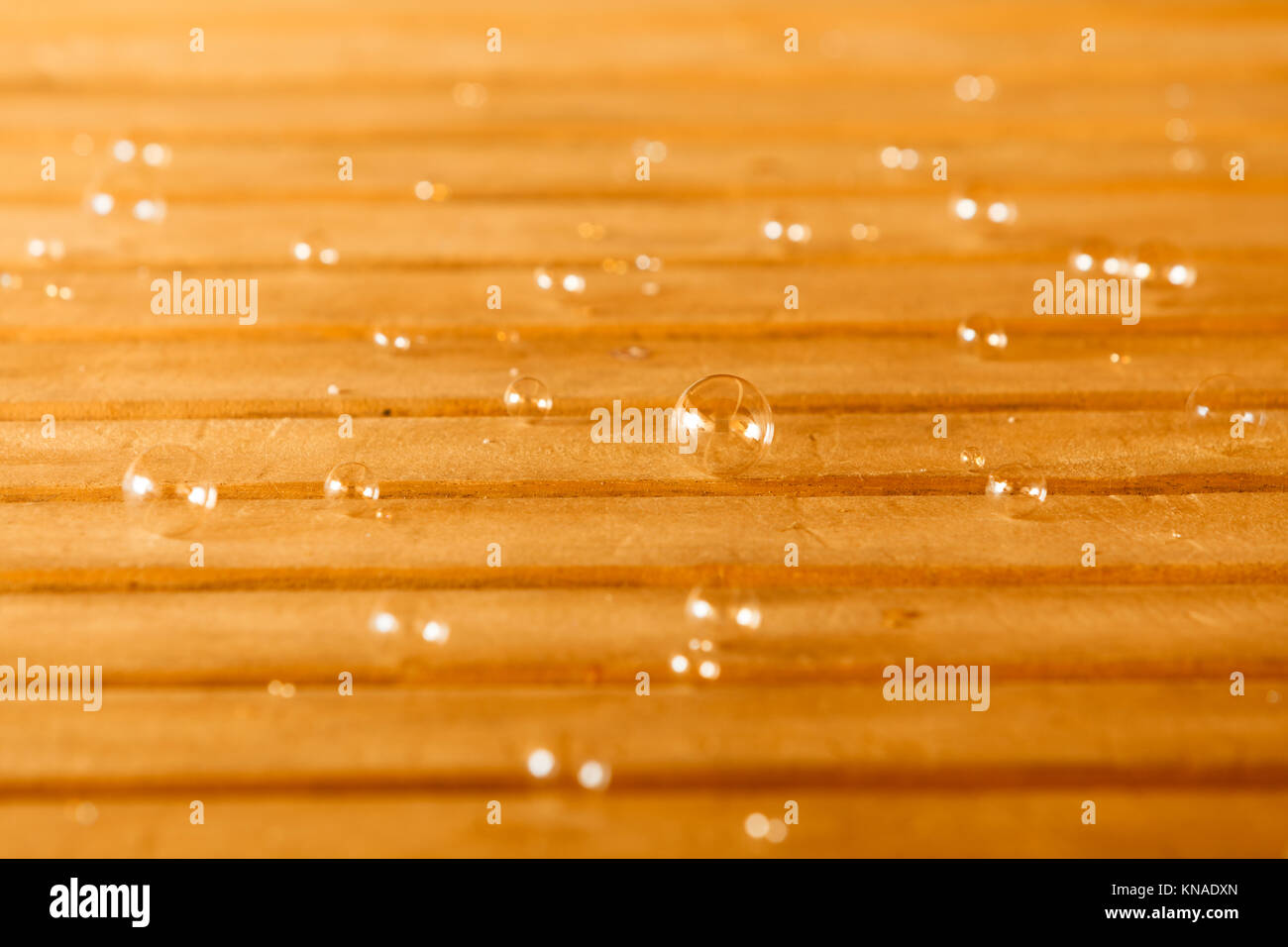 Relax and spa concept. Soap bubbles on wooden bench background in sauna ...