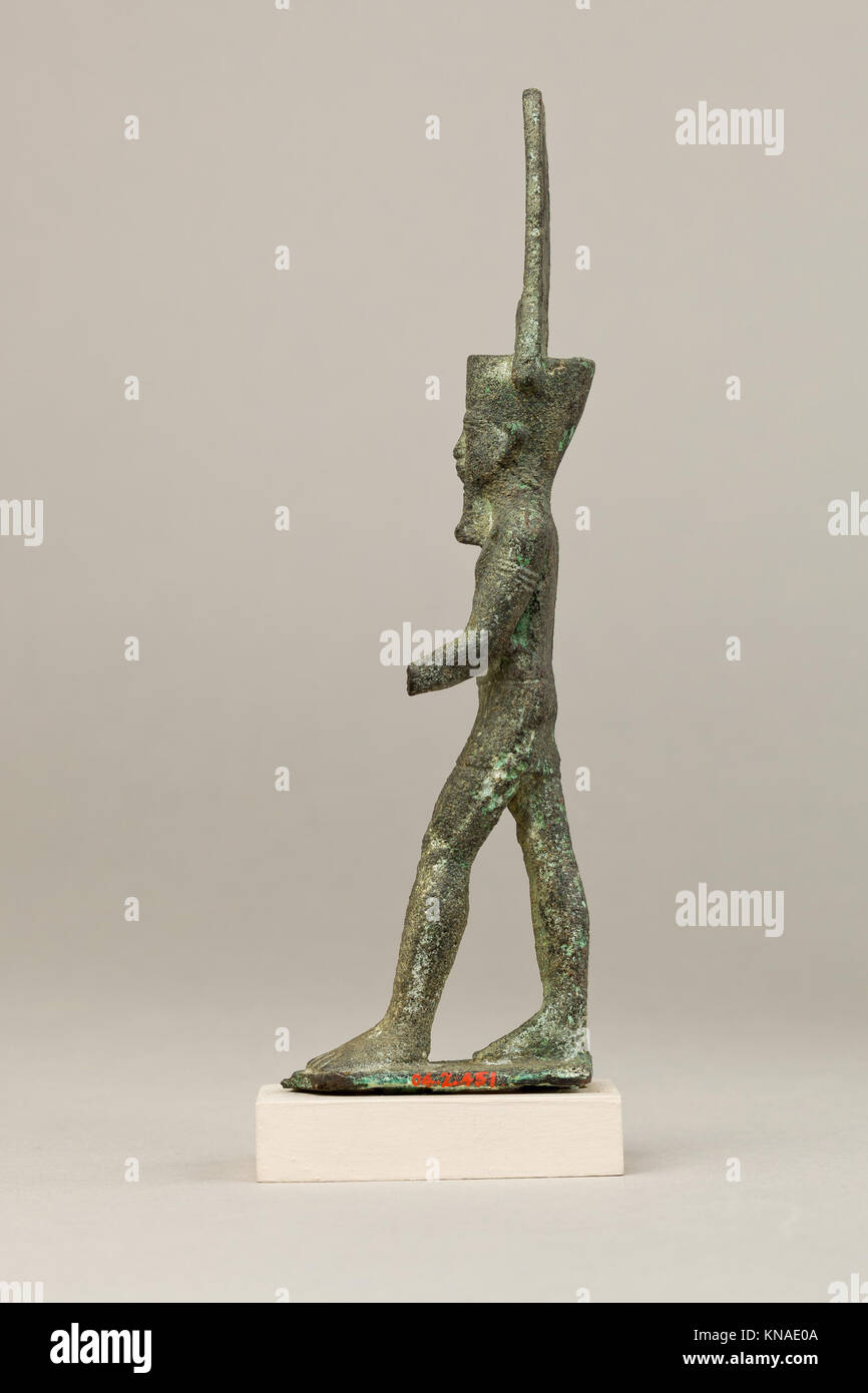 This statue of Amun, an ancient Egyptian deity, represents his typical ...