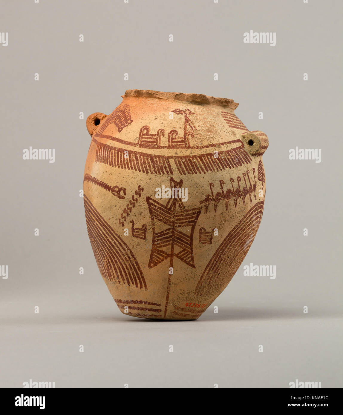 A jar decorated with intricate boat designs, reflecting the artistic ...