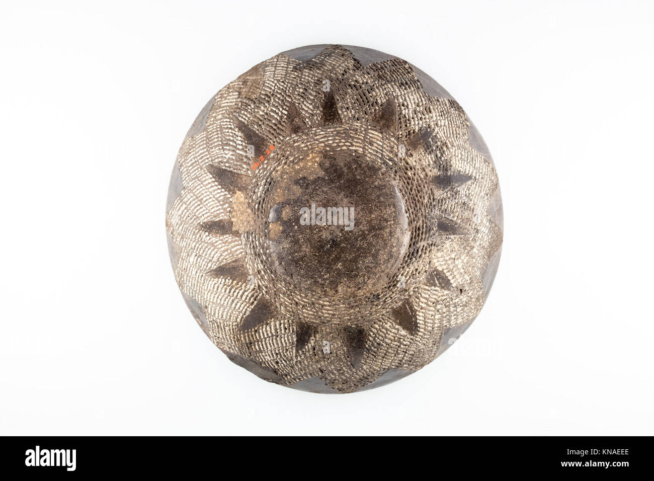 This black incised ware bowl features intricate patterns and is a ...