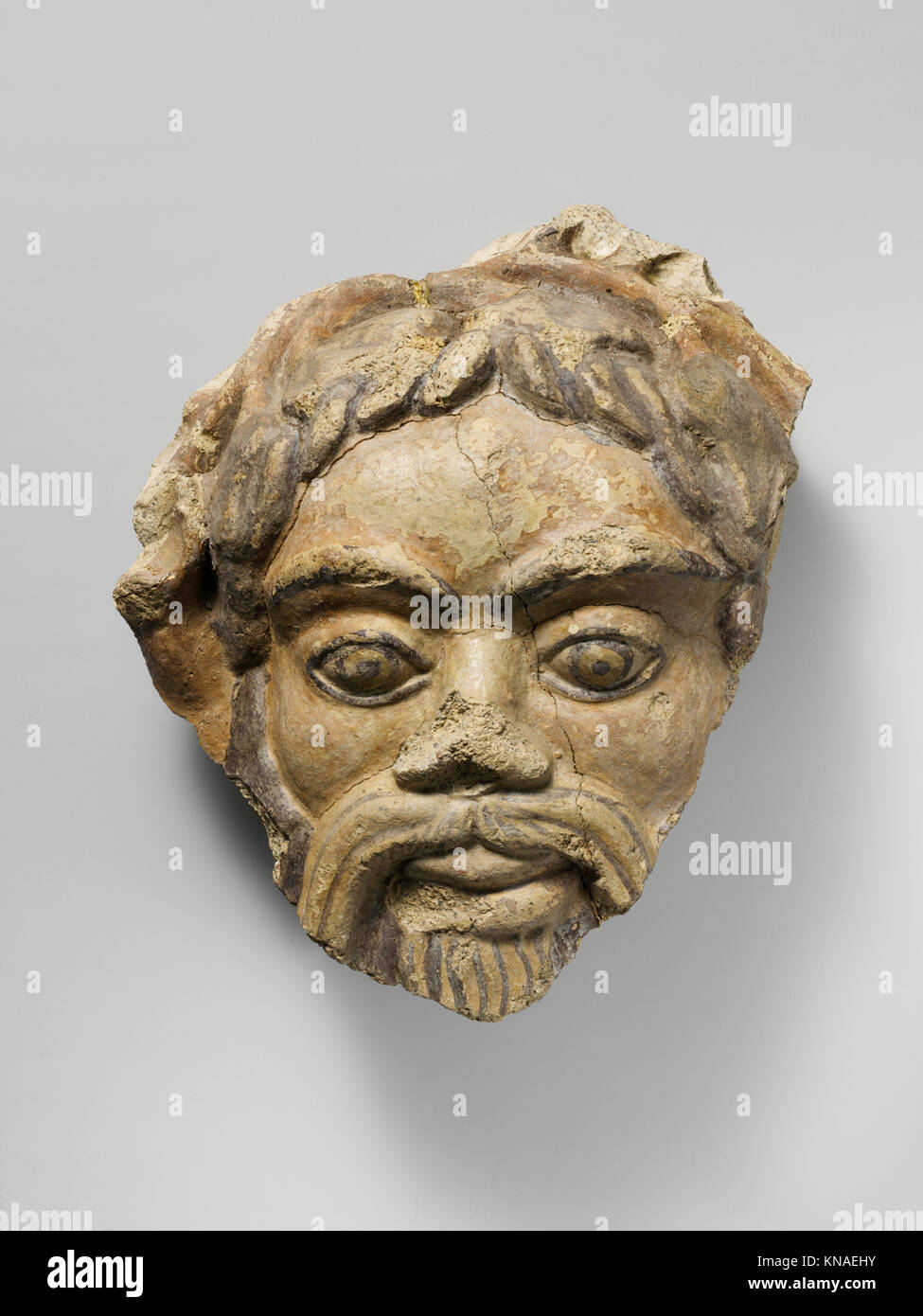 This 5th-century B.C. Etruscan antefix head of a satyr in terracotta ...