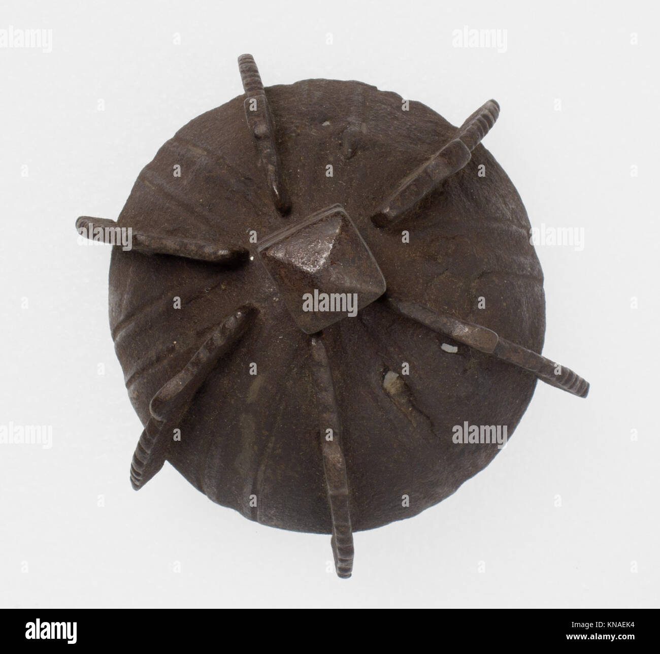 This object, named Boss and Nail, features detailed craftsmanship with ...