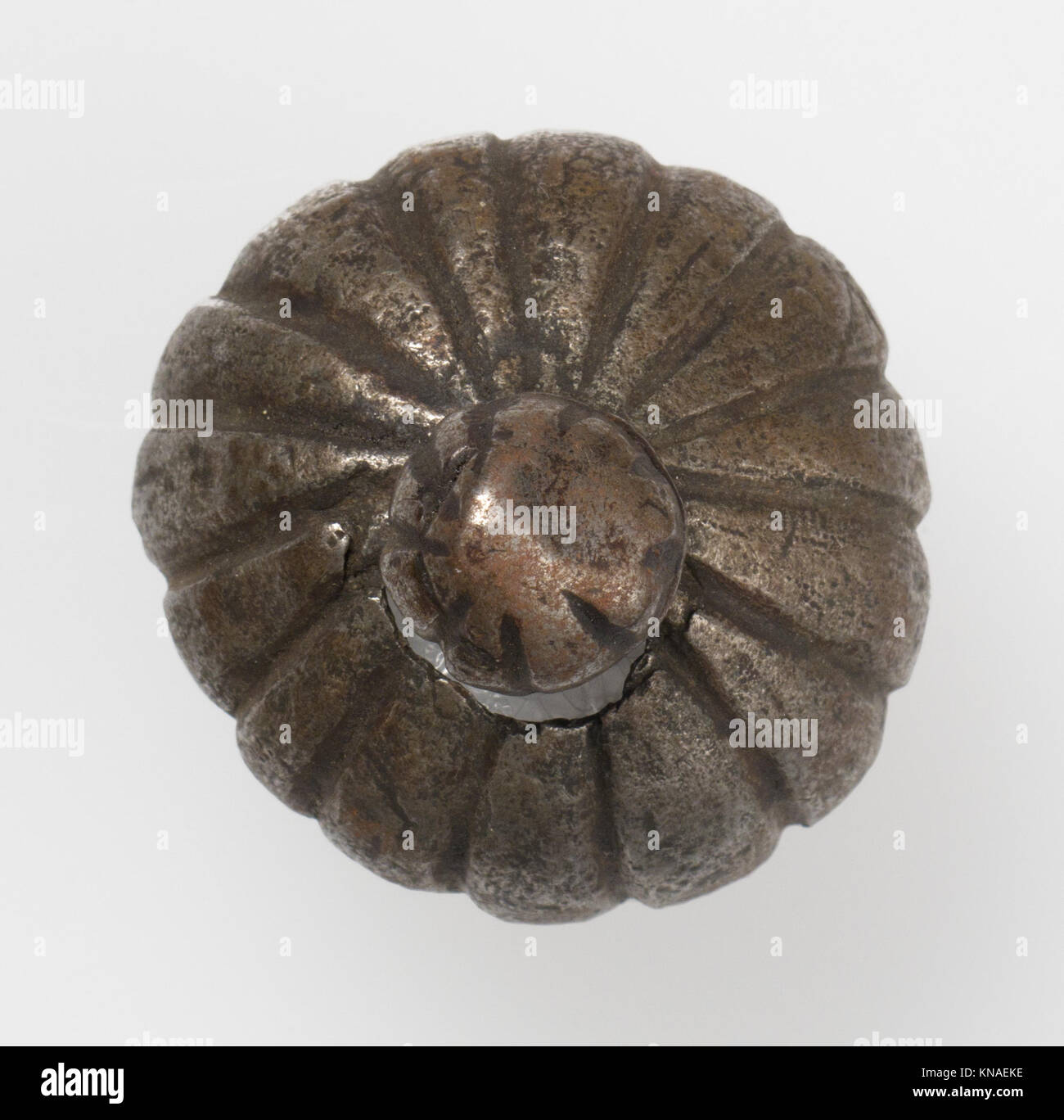 This boss and nail represent decorative elements from a medieval or ...