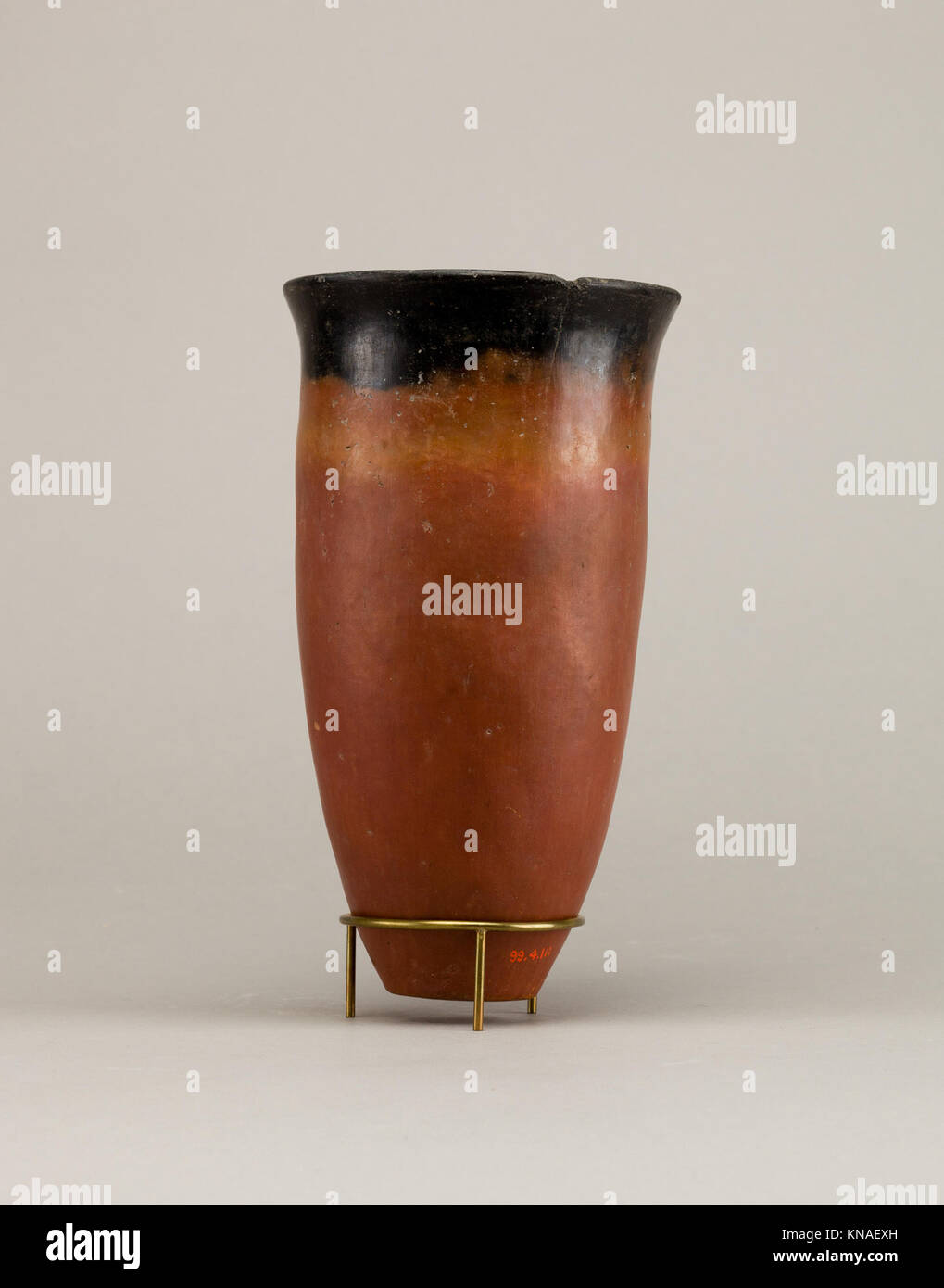 This beaker, made of red ware with a black top, is an example of ...