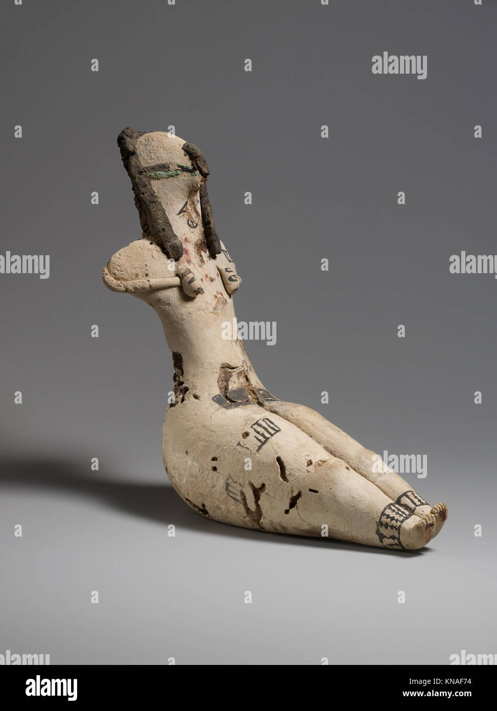 This figurine of a seated woman is a small sculptural work, reflecting ...