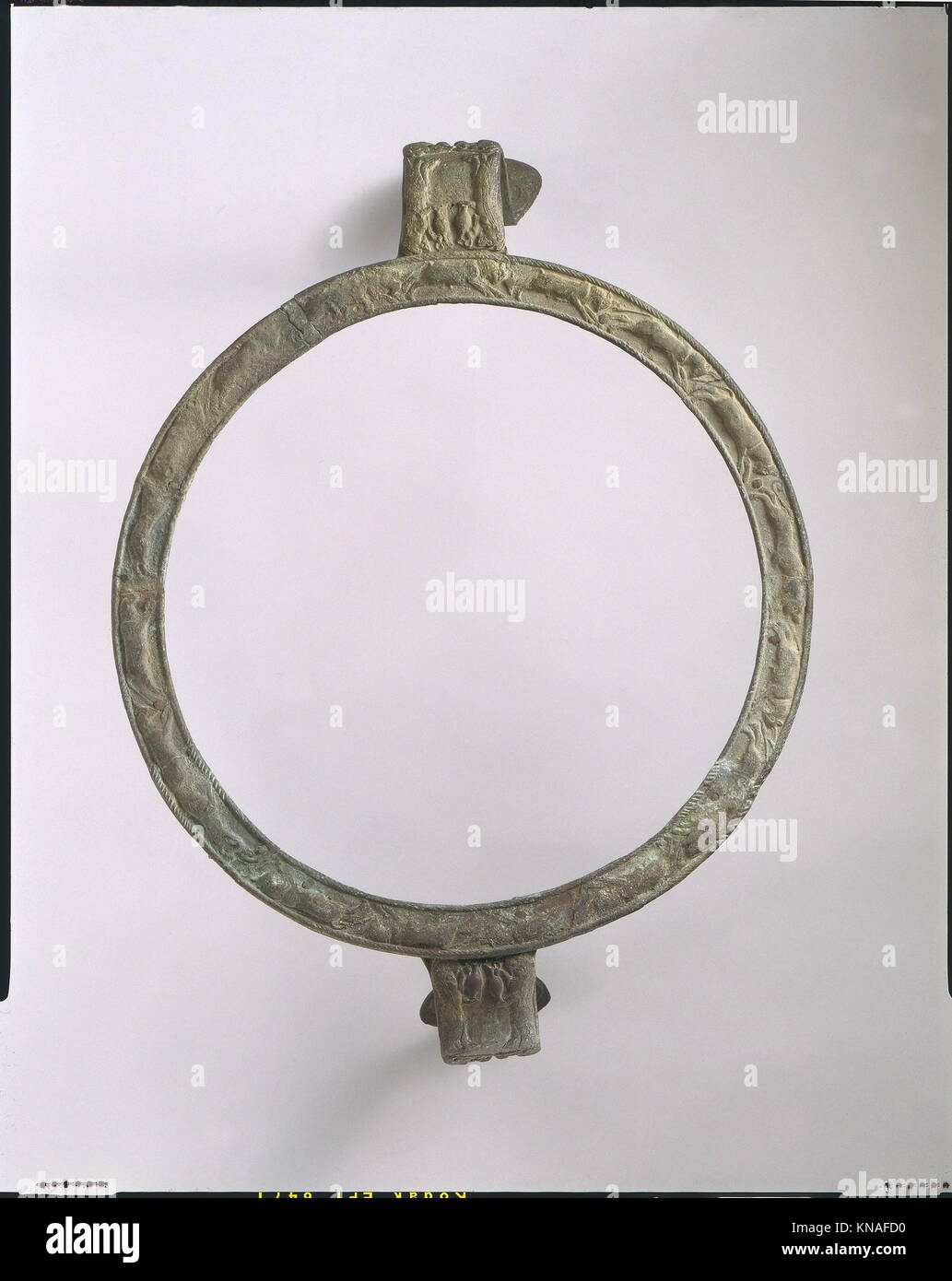 Bronze handles and a rim, possibly from a cauldron, demonstrate ...