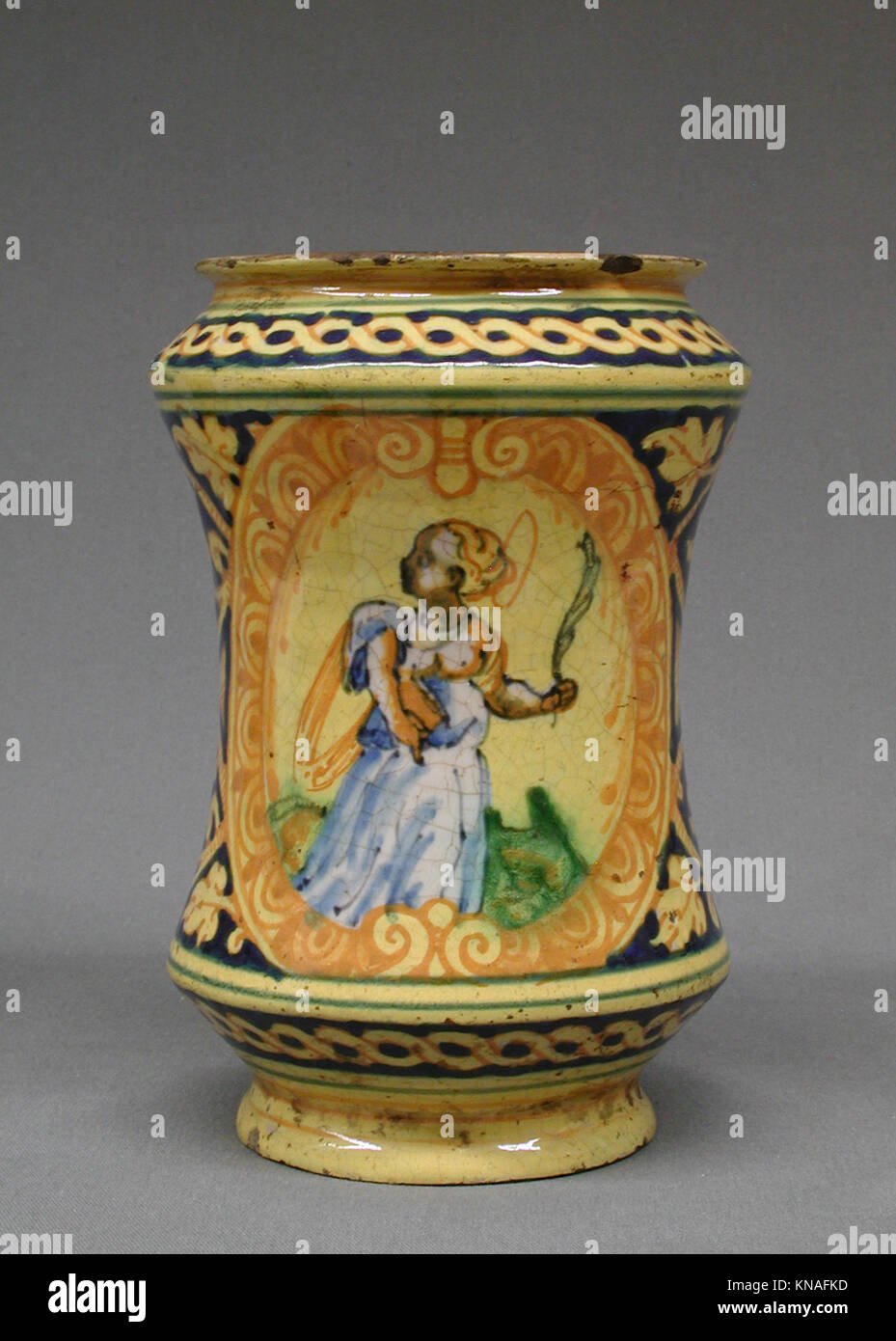 This albarello, a type of Italian ceramic jar, is characterized by its ...