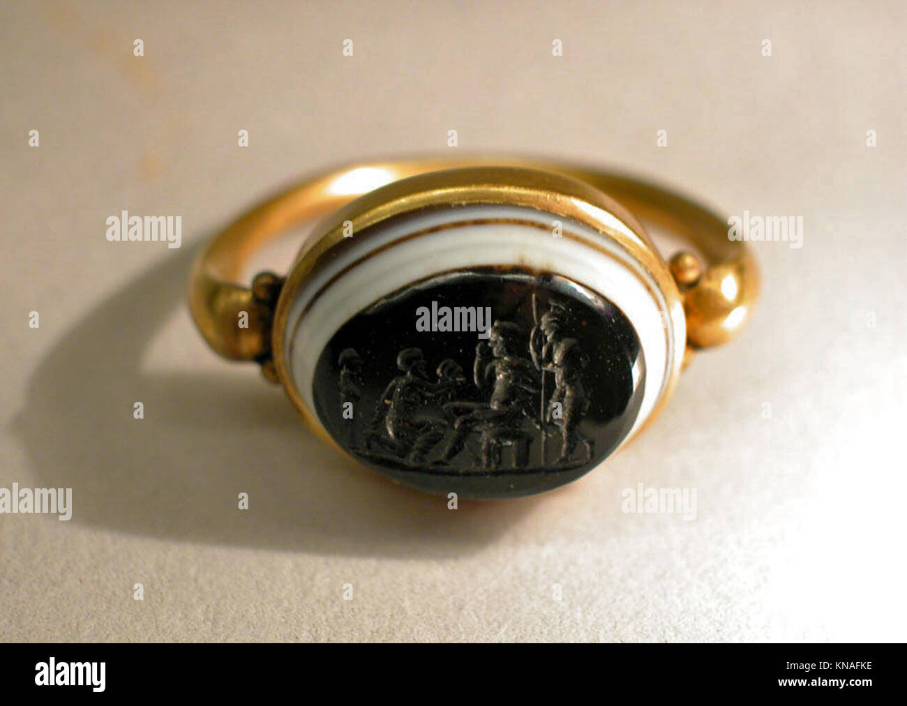 A Roman gold ring featuring an onyx intaglio, dating from the late 2nd ...