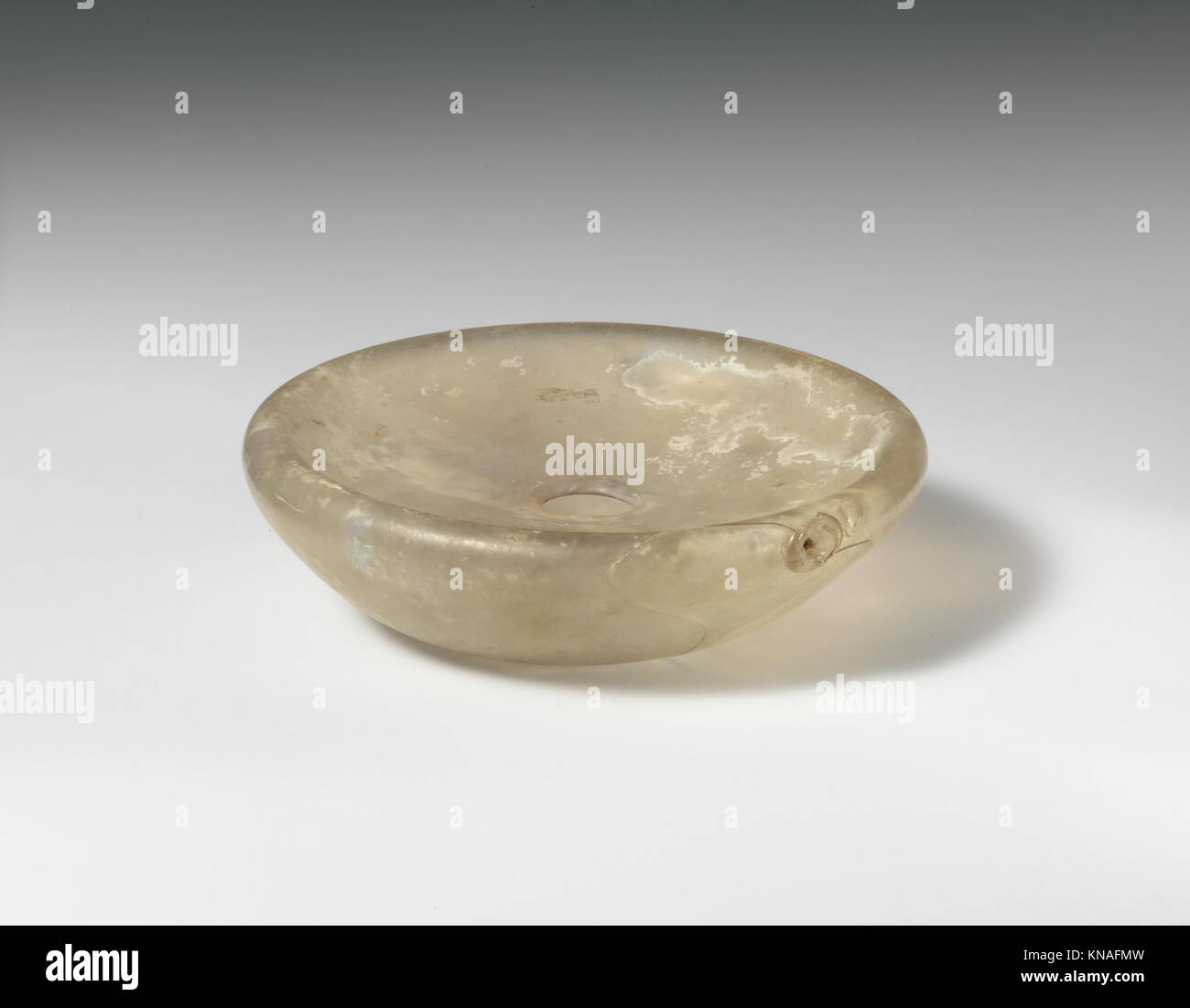 This glass bowl, potentially used as an inkwell, showcases the ...