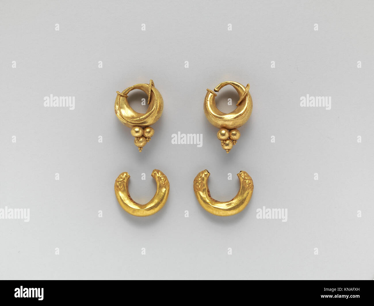 Gold boat shaped earrings hi-res stock photography and images - Alamy