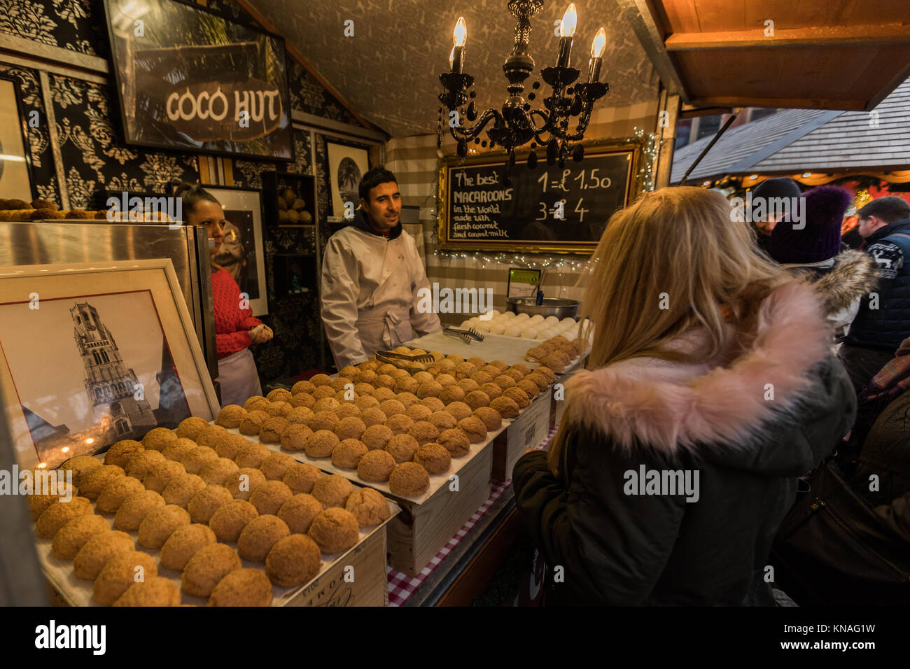 Market stall traders serve food and drink to customers at Manchester ...