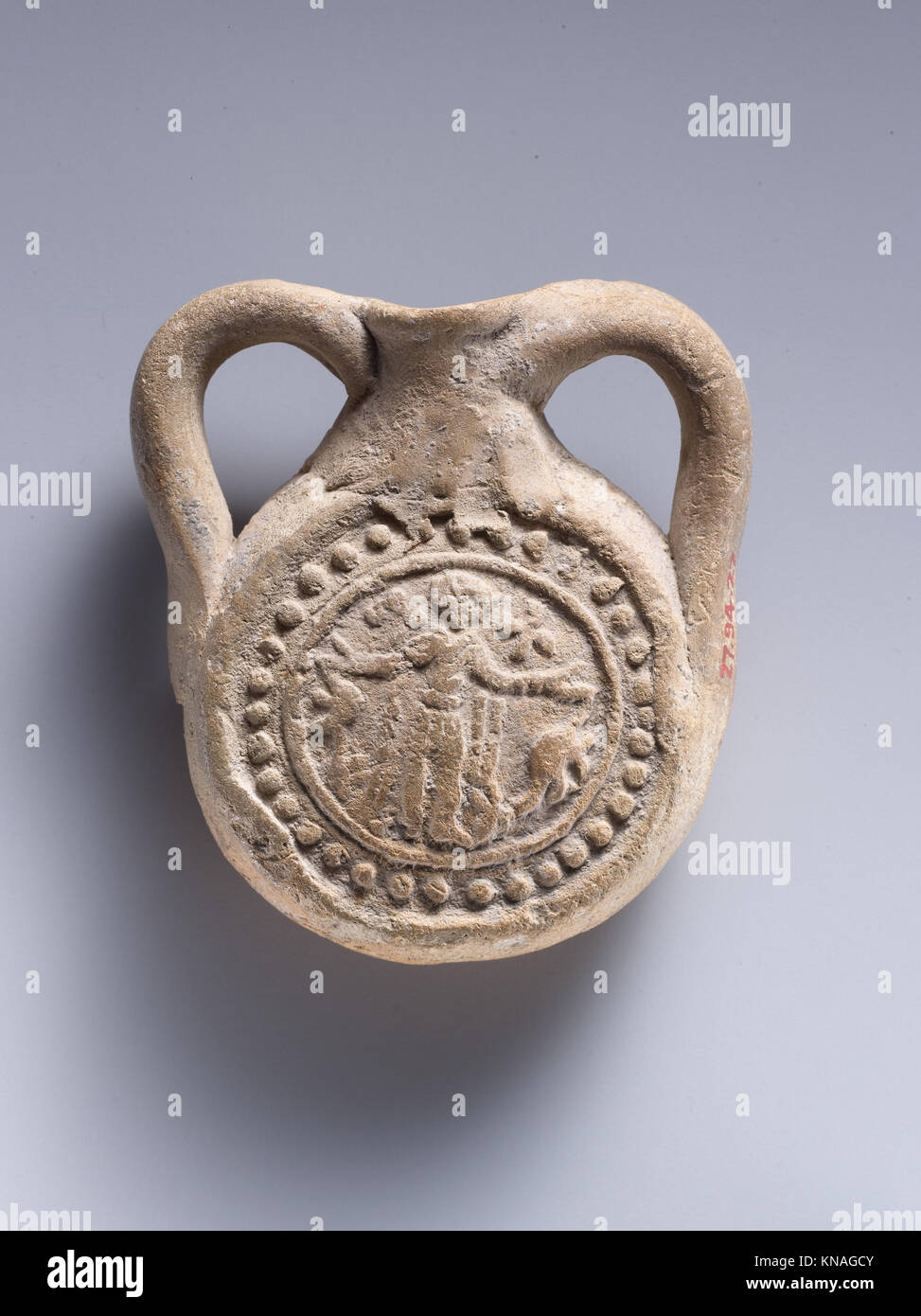 This ampulla (flask) MET DP258369 447987 depicts Saint Menas, serving ...