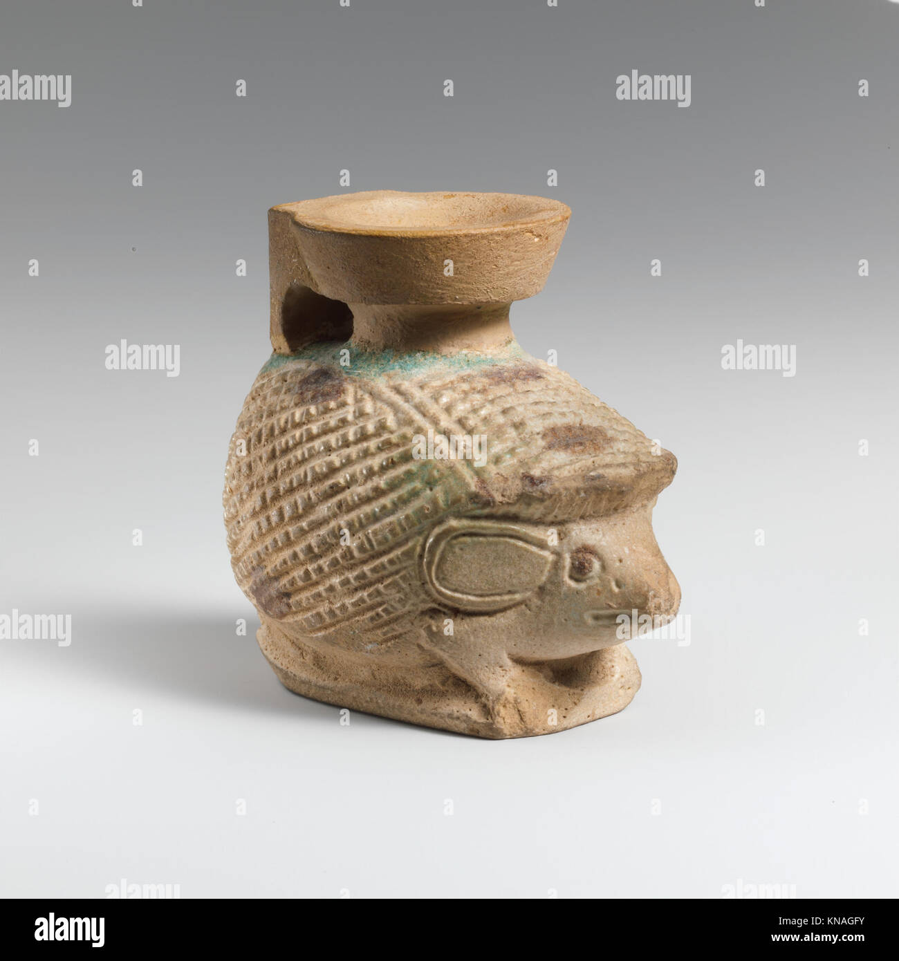 This East Greek faience aryballos, dated to the 6th century B.C., is ...