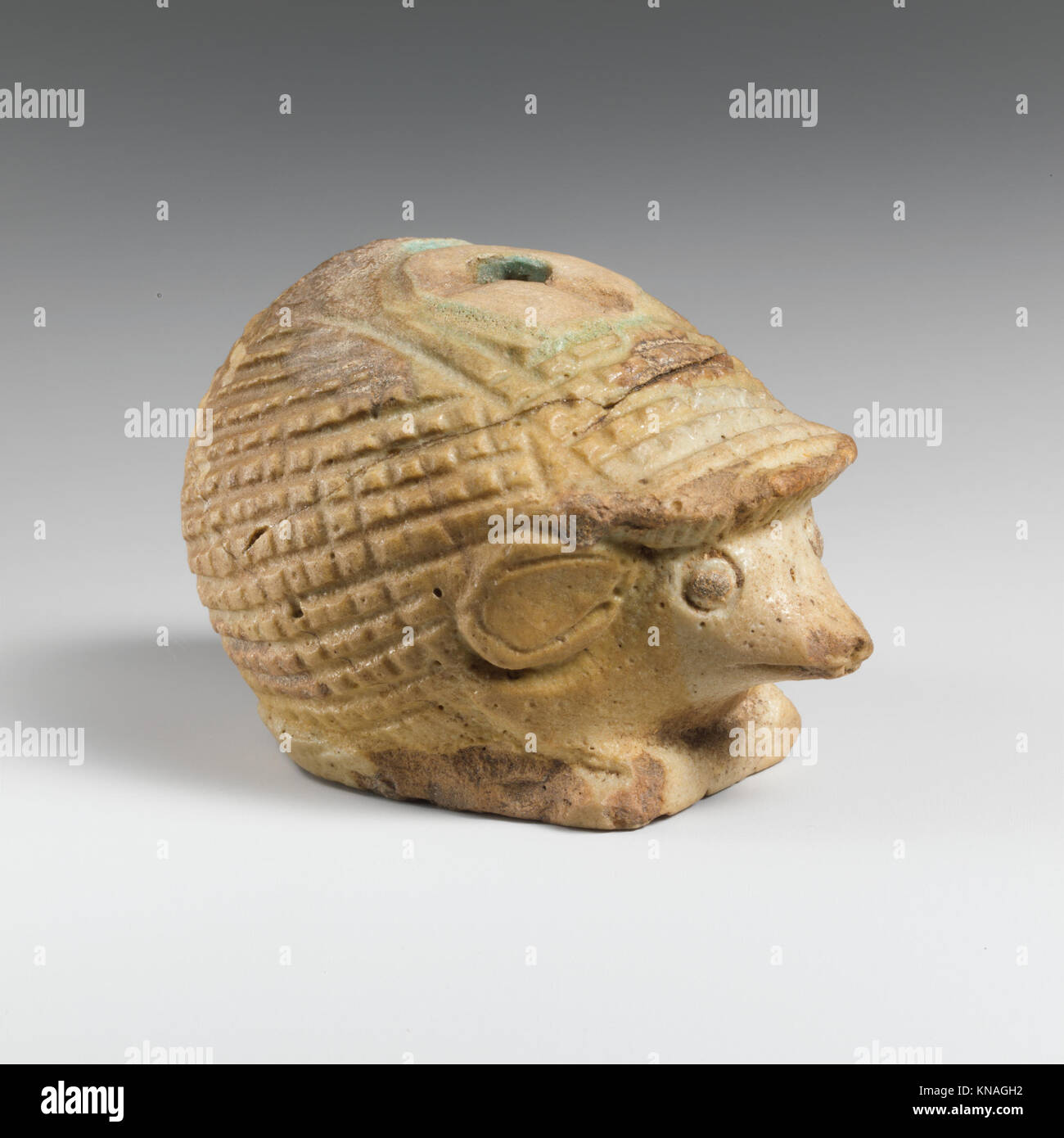 This 6th-century B.C. East Greek faience aryballos is shaped like a ...