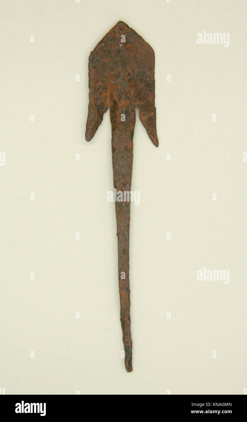 This arrowhead, crafted from stone, represents a prehistoric tool used ...