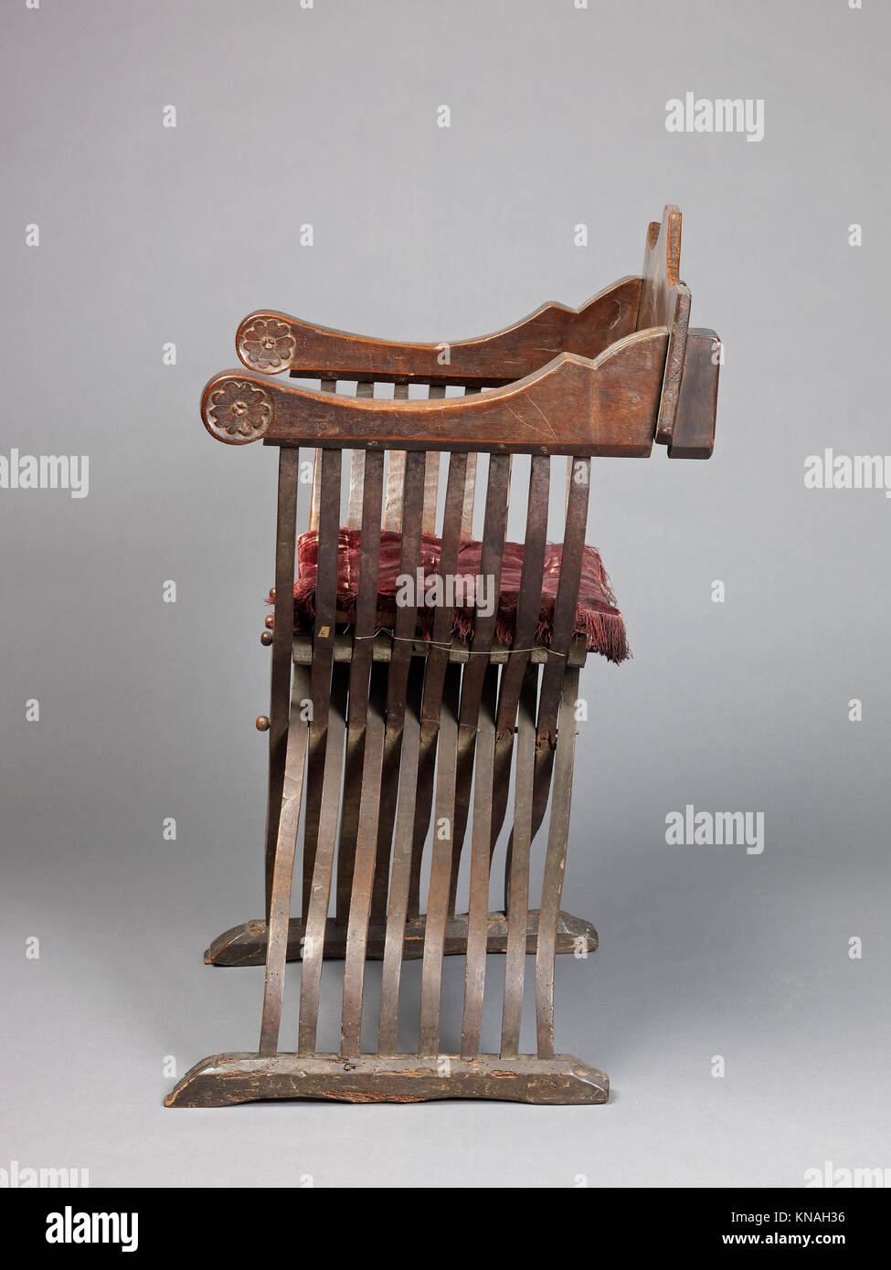A folding armchair of the 'Sedia a Savonarola' type, part of The ...