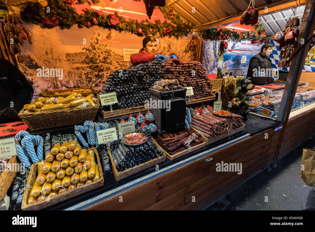 Market stall traders serve food and drink to customers at Manchester ...