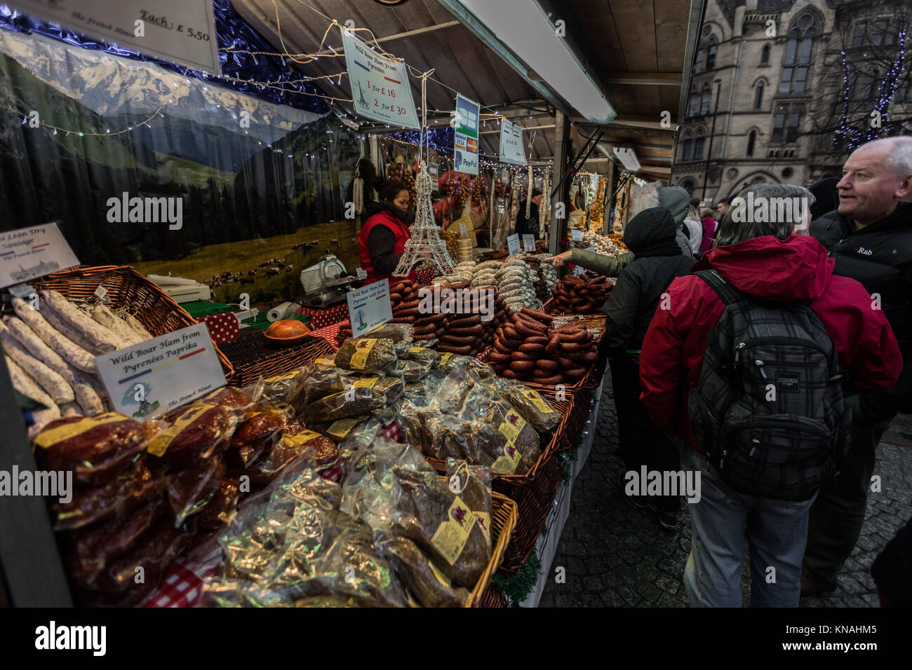 Market stall traders serve food and drink to customers at Manchester ...