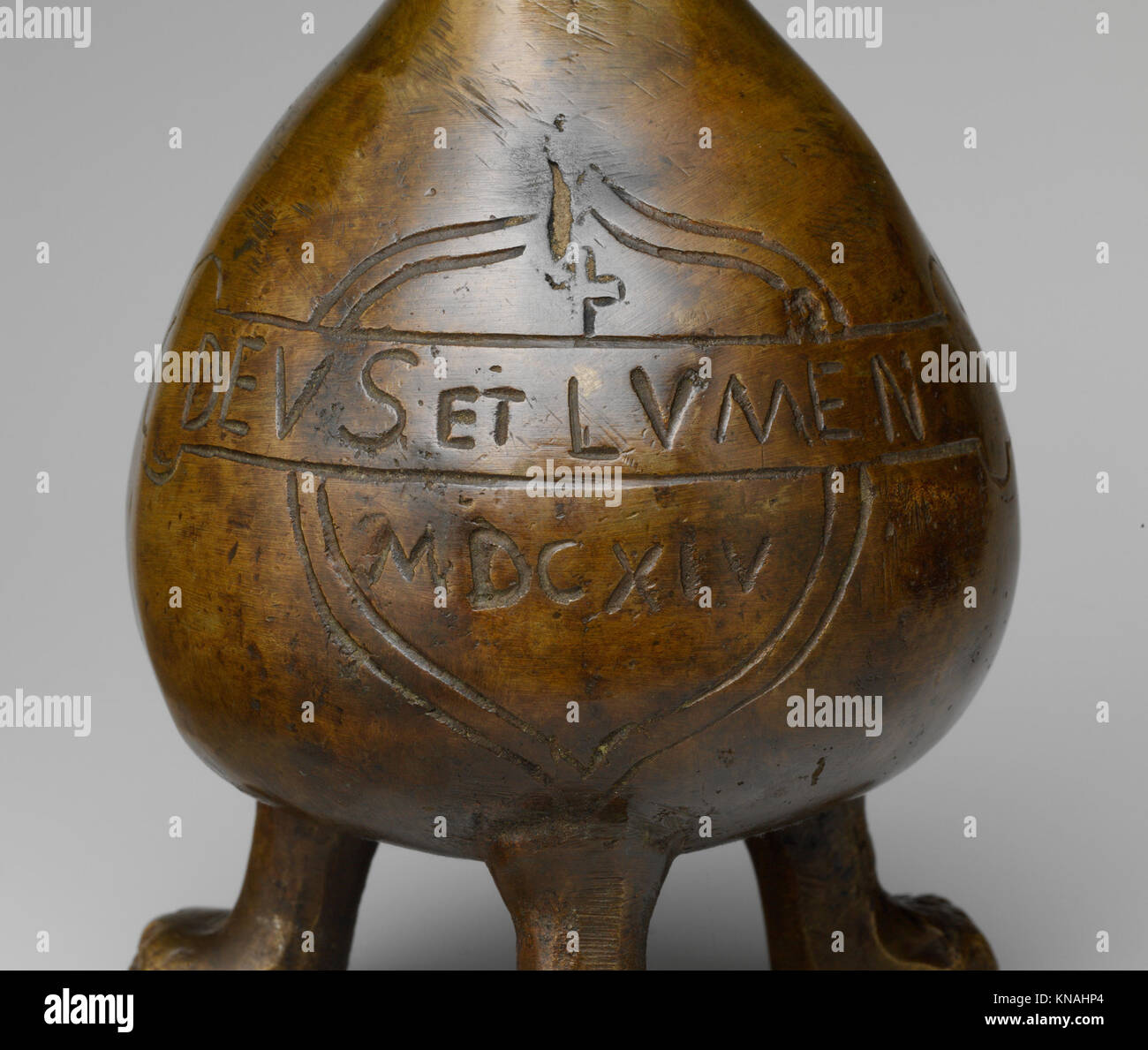 This aquamanile, shaped like a gourd with a human head, is a vessel ...