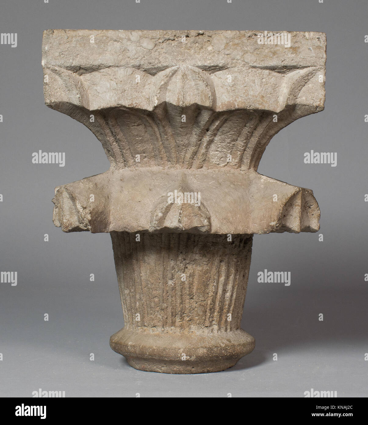 This capital, part of a column or pillar, features architectural ...