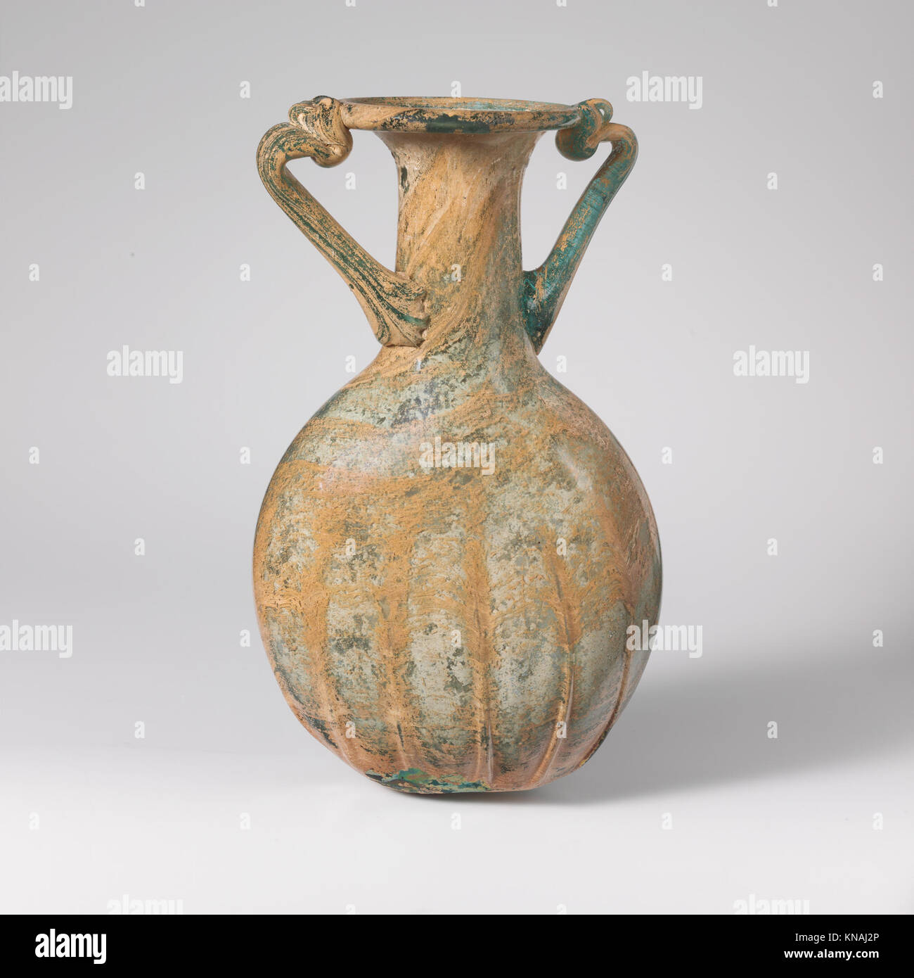 This glass lentoid bottle, featuring two handles, is a functional and ...