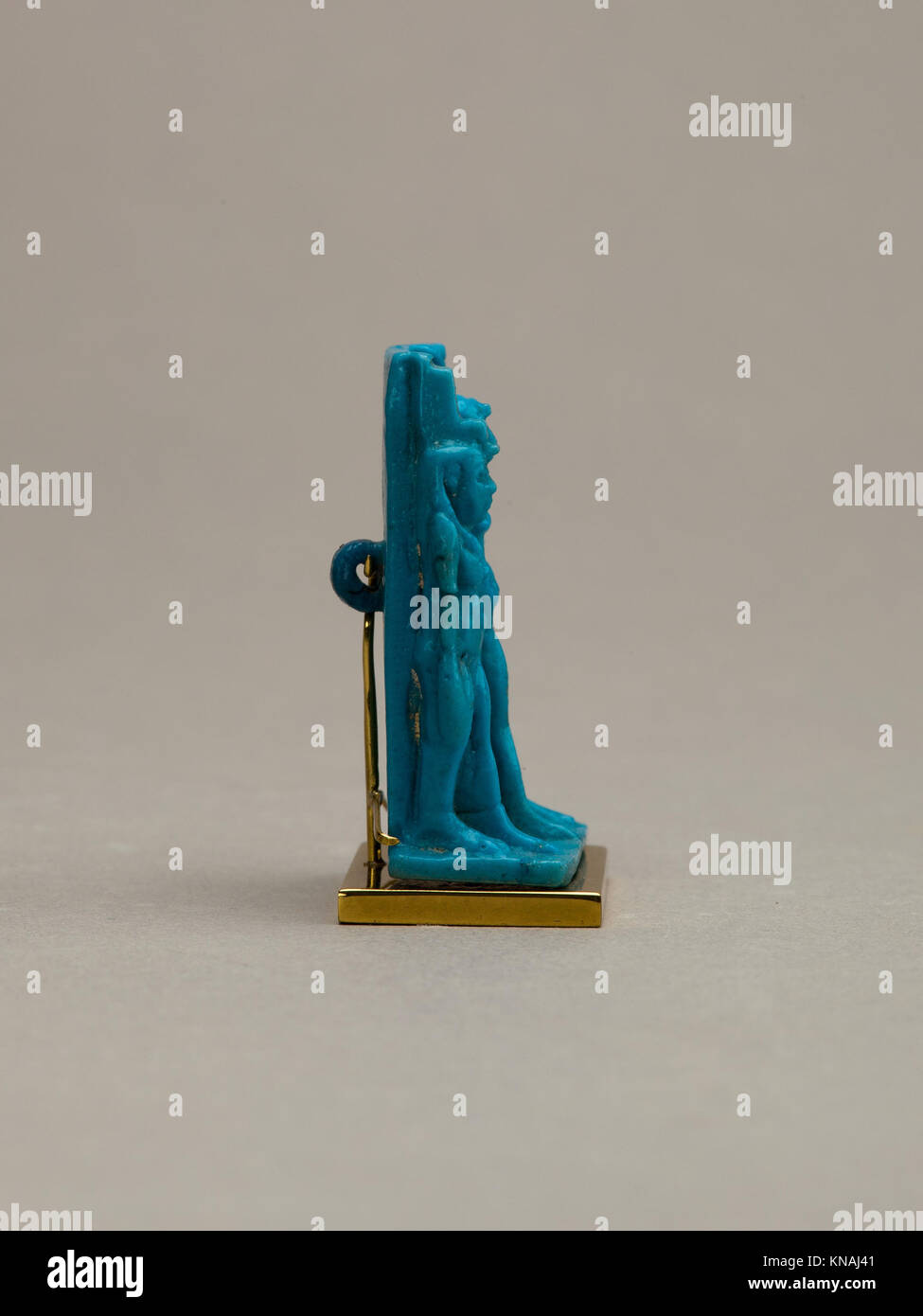 This Egyptian amulet depicts the triad of deities Isis, Horus, and ...
