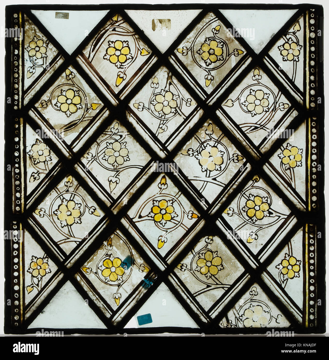 This glass panel, featuring intricate designs, serves as an example of ...