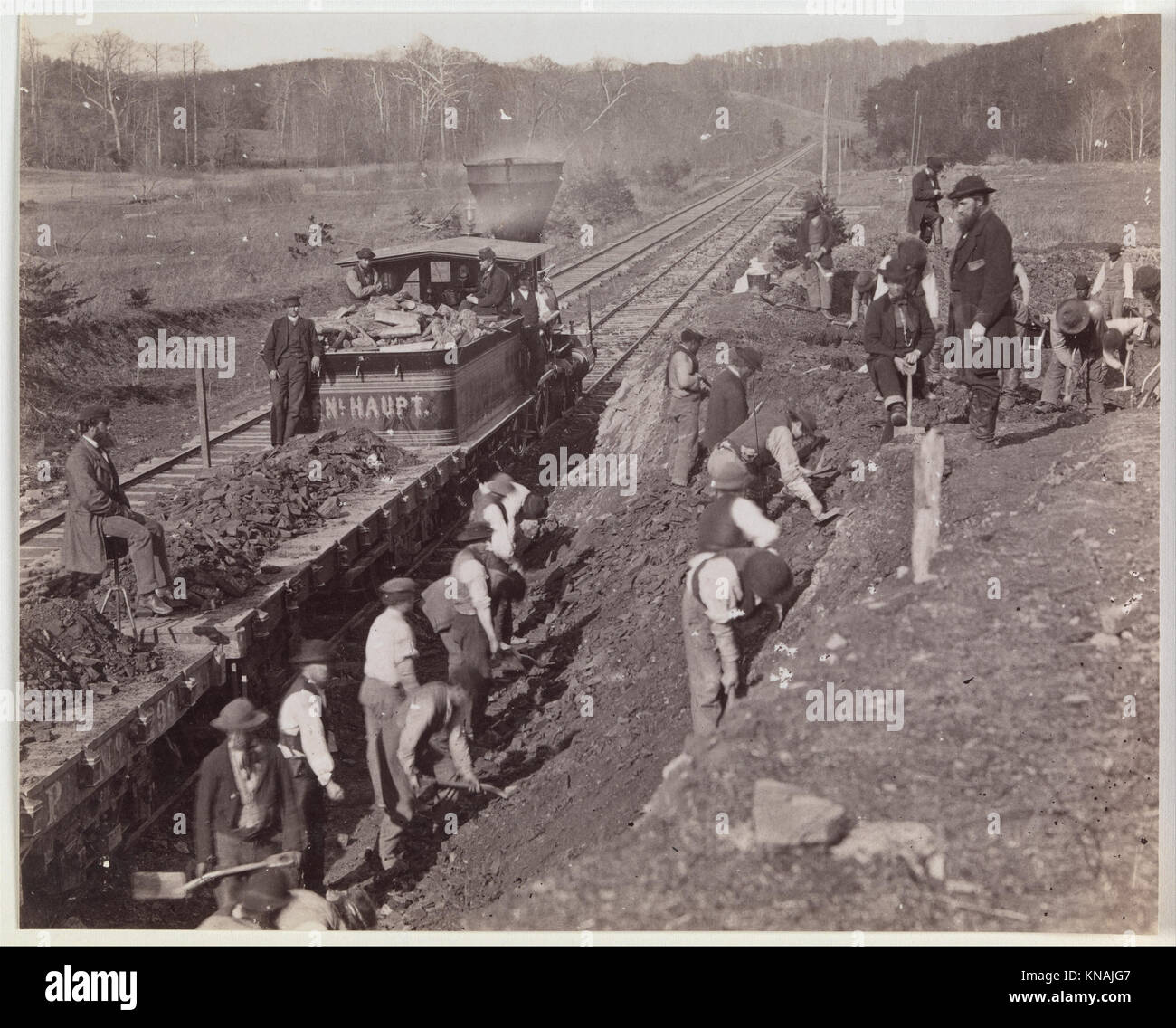 This historical photograph shows the excavation site at Devereaux ...