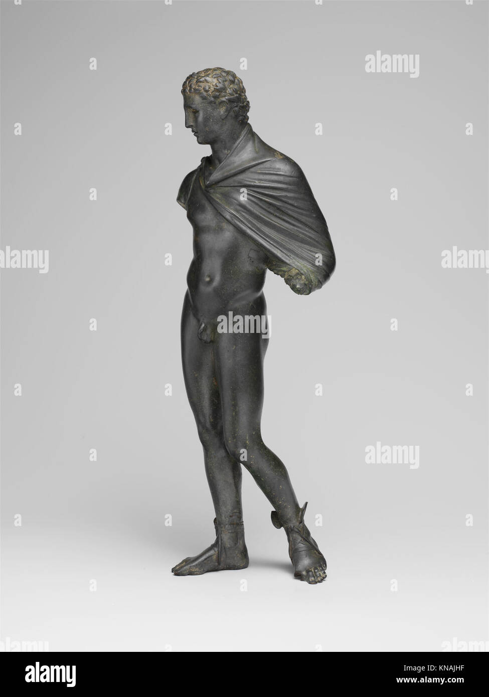 A bronze statuette of Hermes, the Greek messenger god, showcasing ...