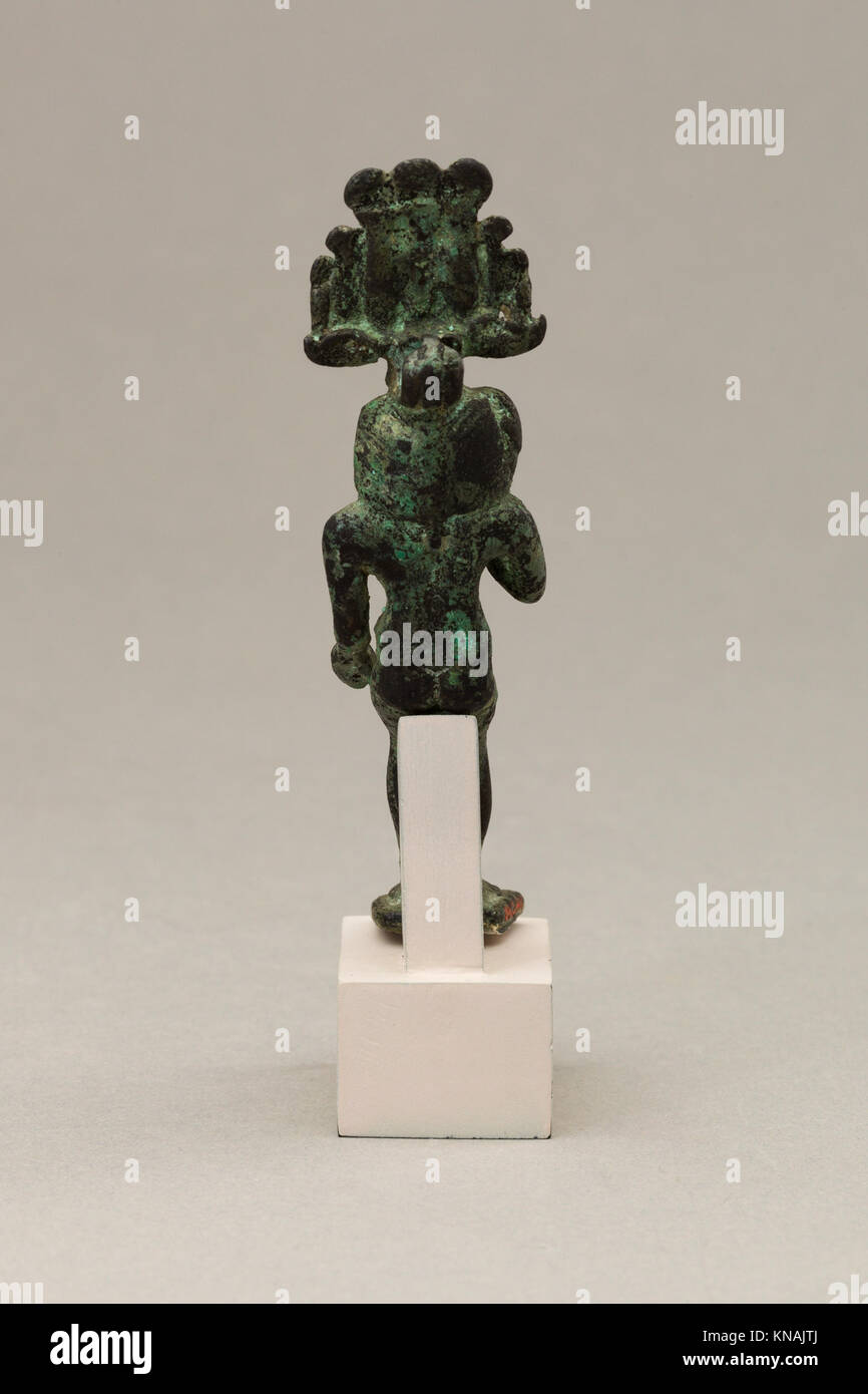 This sculpture portrays a child god wearing a hemhem crown, a symbol of ...