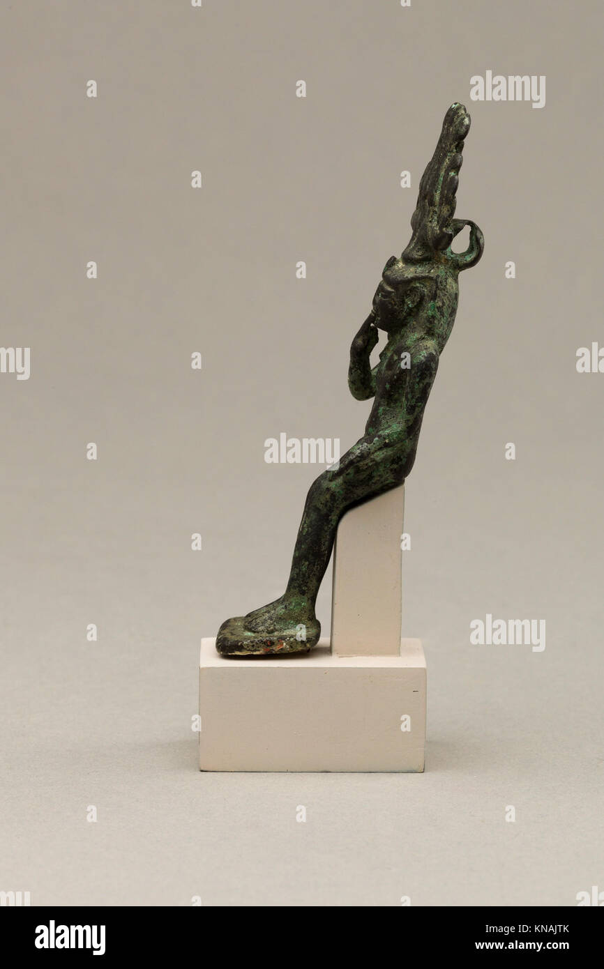 This child god figurine is adorned with the hemhem crown, a distinctive ...