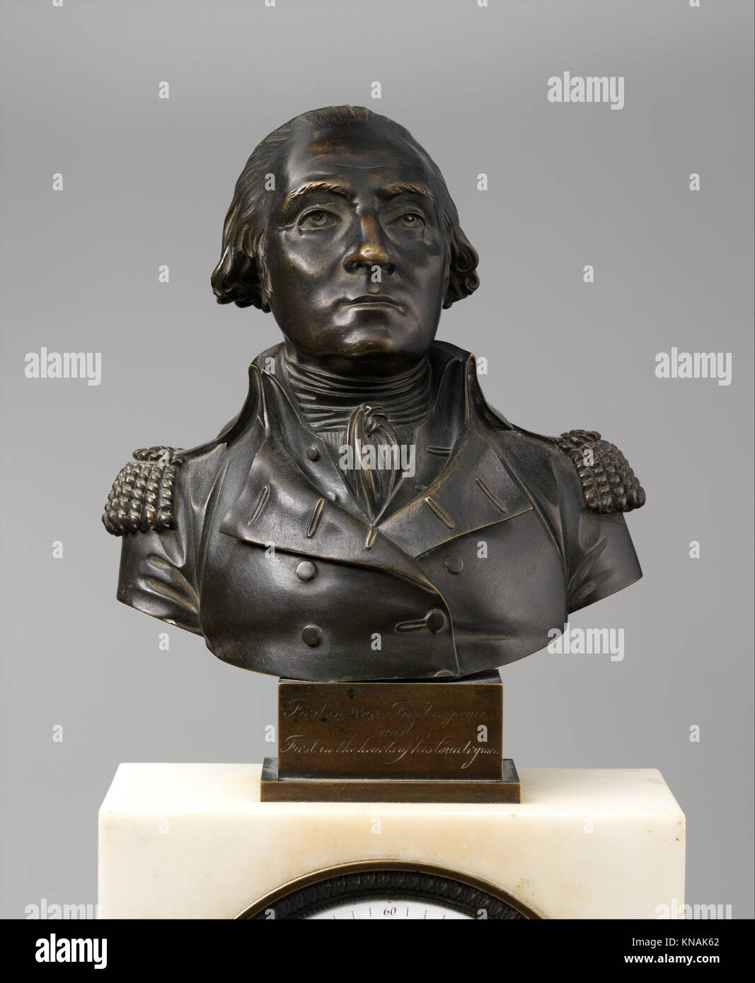 A clock featuring a bust of George Washington and a relief depicting ...