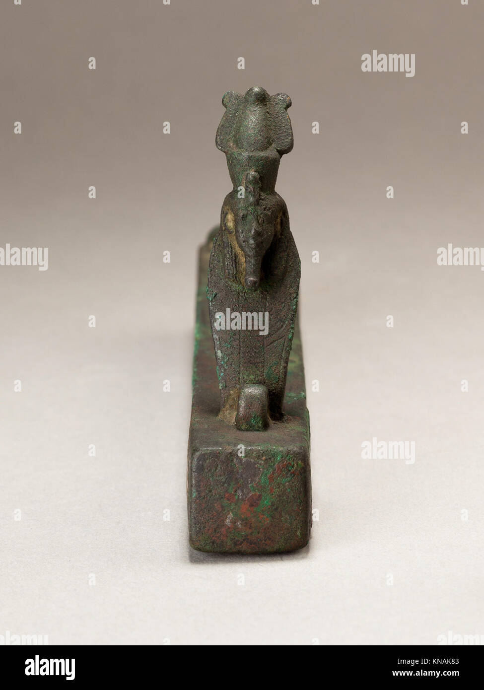 This depiction of Atum as a human-headed cobra sits atop a box intended ...