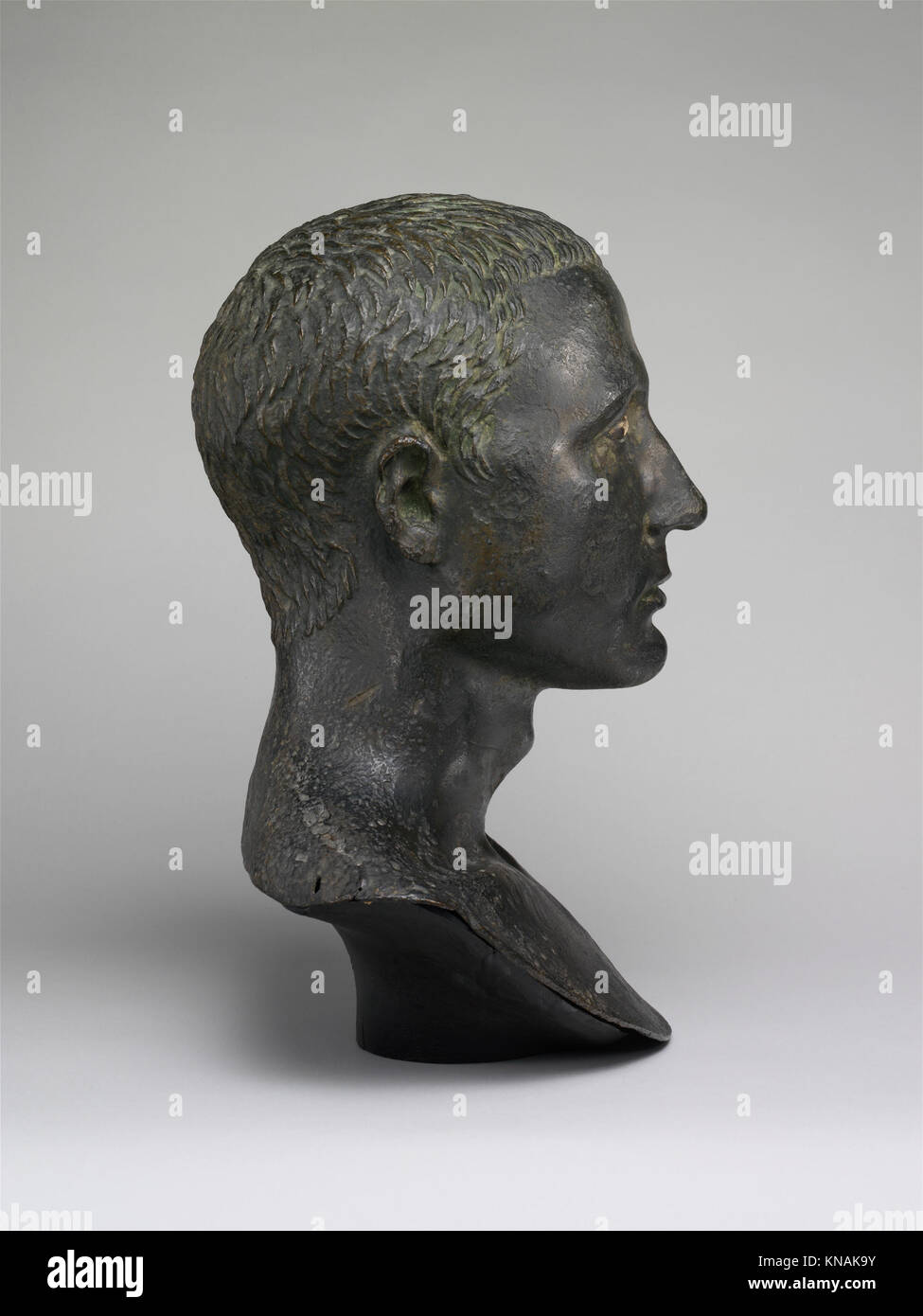 A bronze portrait bust depicting a man, possibly an ancient figure ...