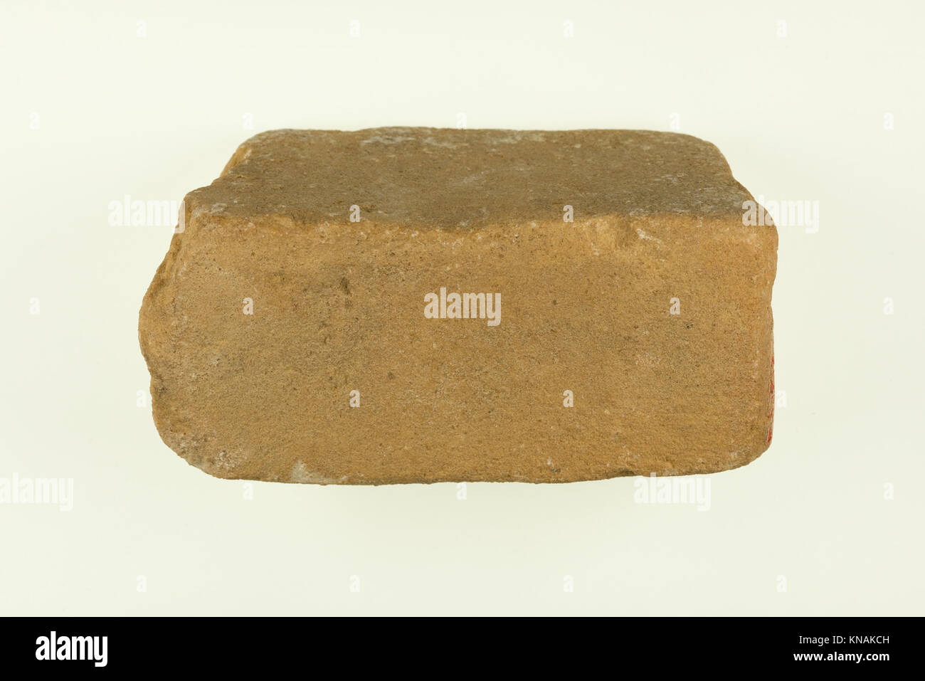This grinding stone is an ancient tool used for sharpening and grinding ...