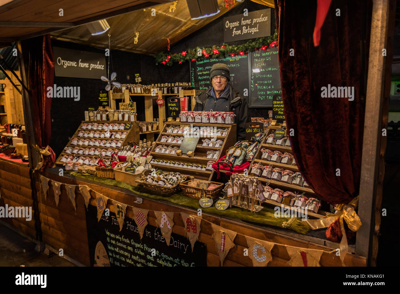 Market stall traders serve food and drink to customers at Manchester ...