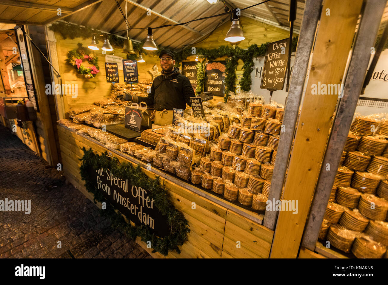 Market stall traders serve food and drink to customers at Manchester ...