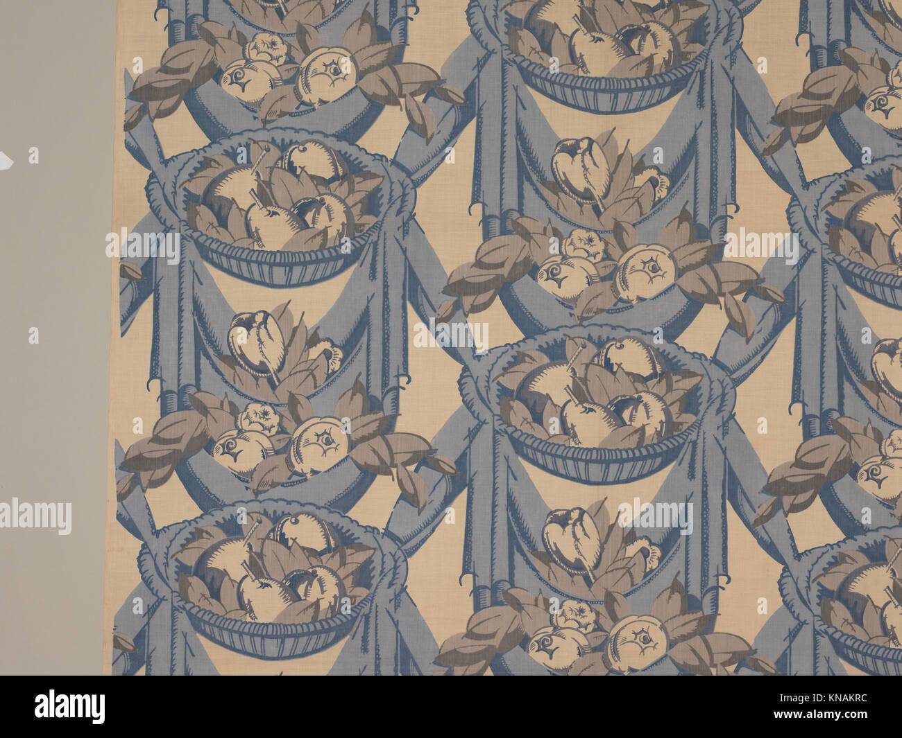 This textile, featuring drapery designs, demonstrates intricate weaving ...