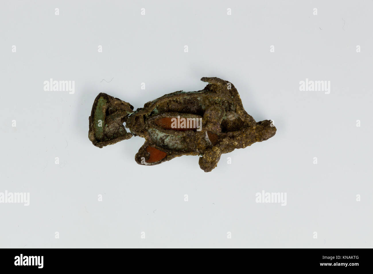A fish-shaped amulet, cataloged as MET 15.3.85, carved from stone ...