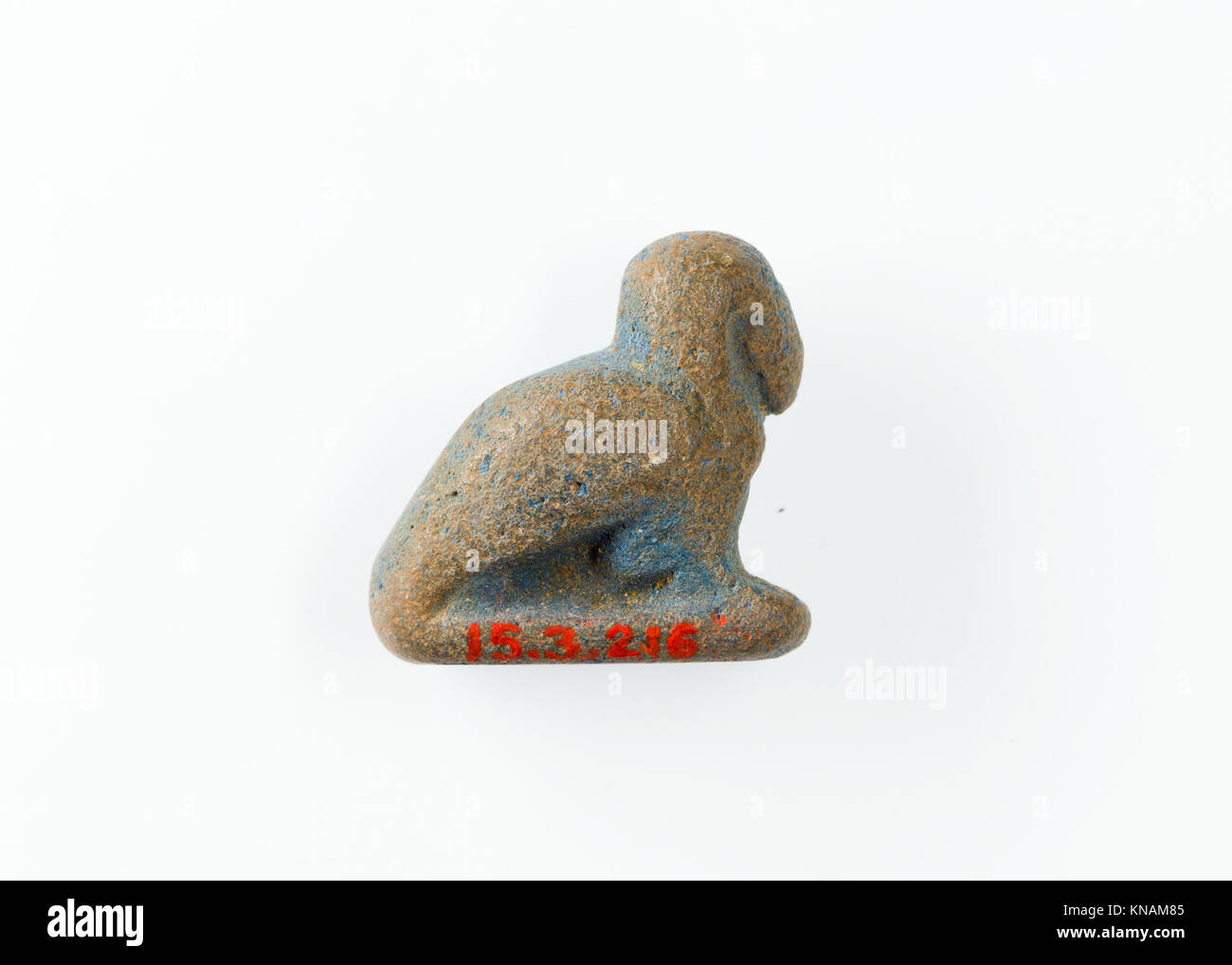 A small animal amulet, likely crafted from metal or stone, featuring a ...