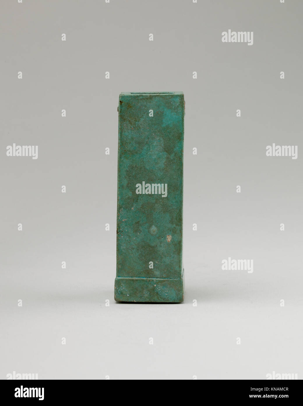 A clepsydra (water clock) featuring a squatting baboon, identified as ...